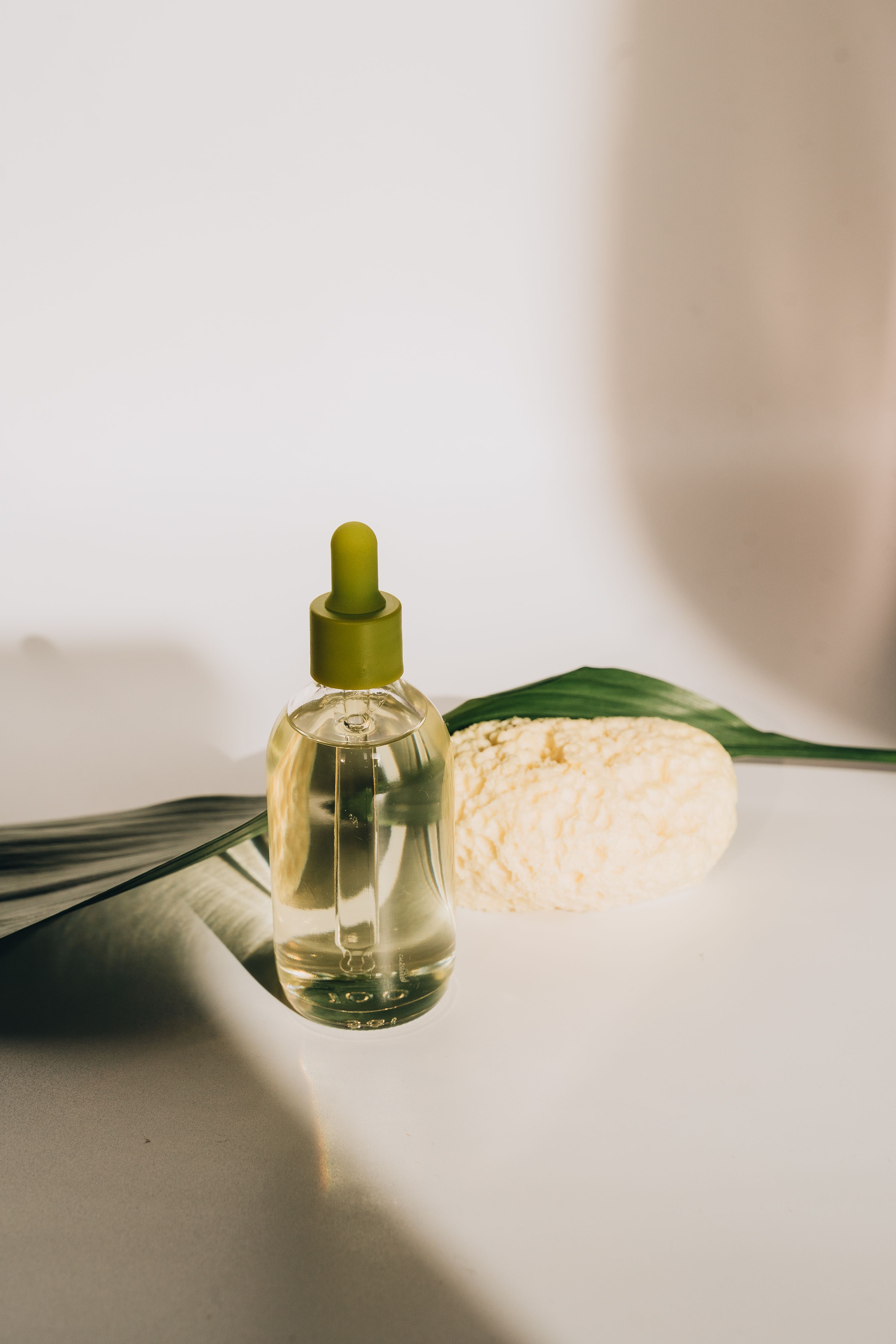 Clear Glass Bottle With Yellow Liquid · Free Stock Photo