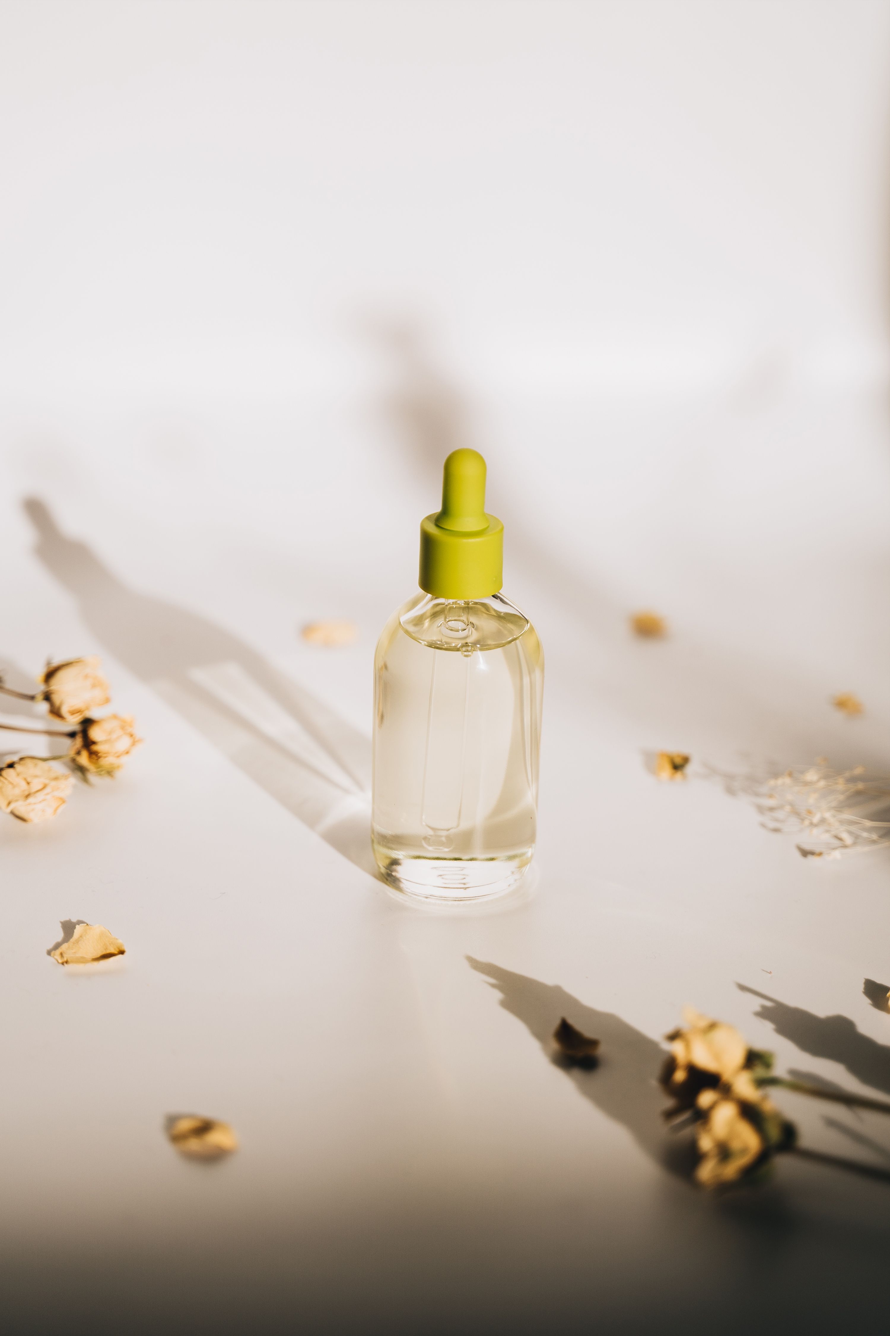 Assorted cosmetic products reflecting on smooth table · Free Stock Photo