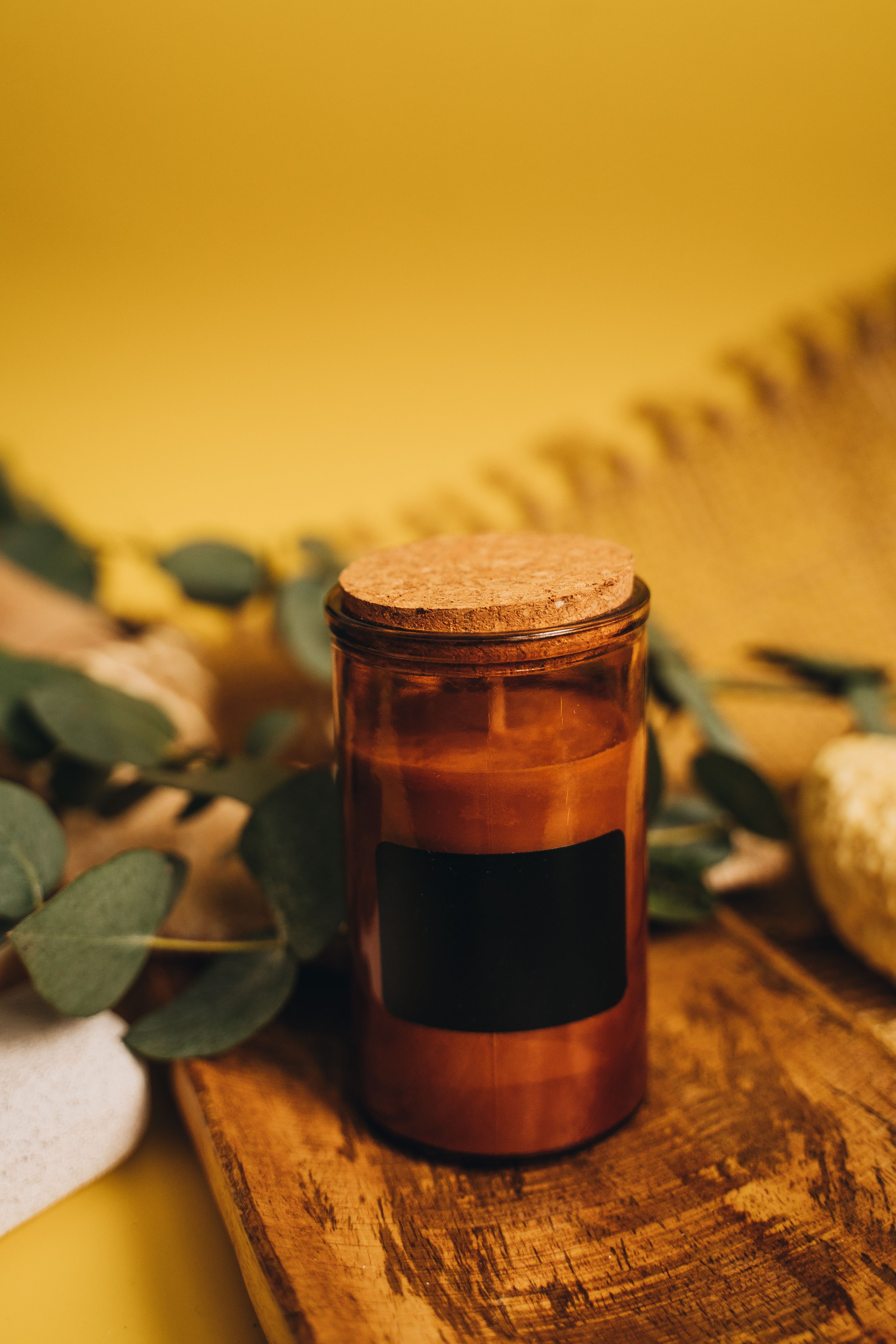 Candle in a Brown Glass Container · Free Stock Photo