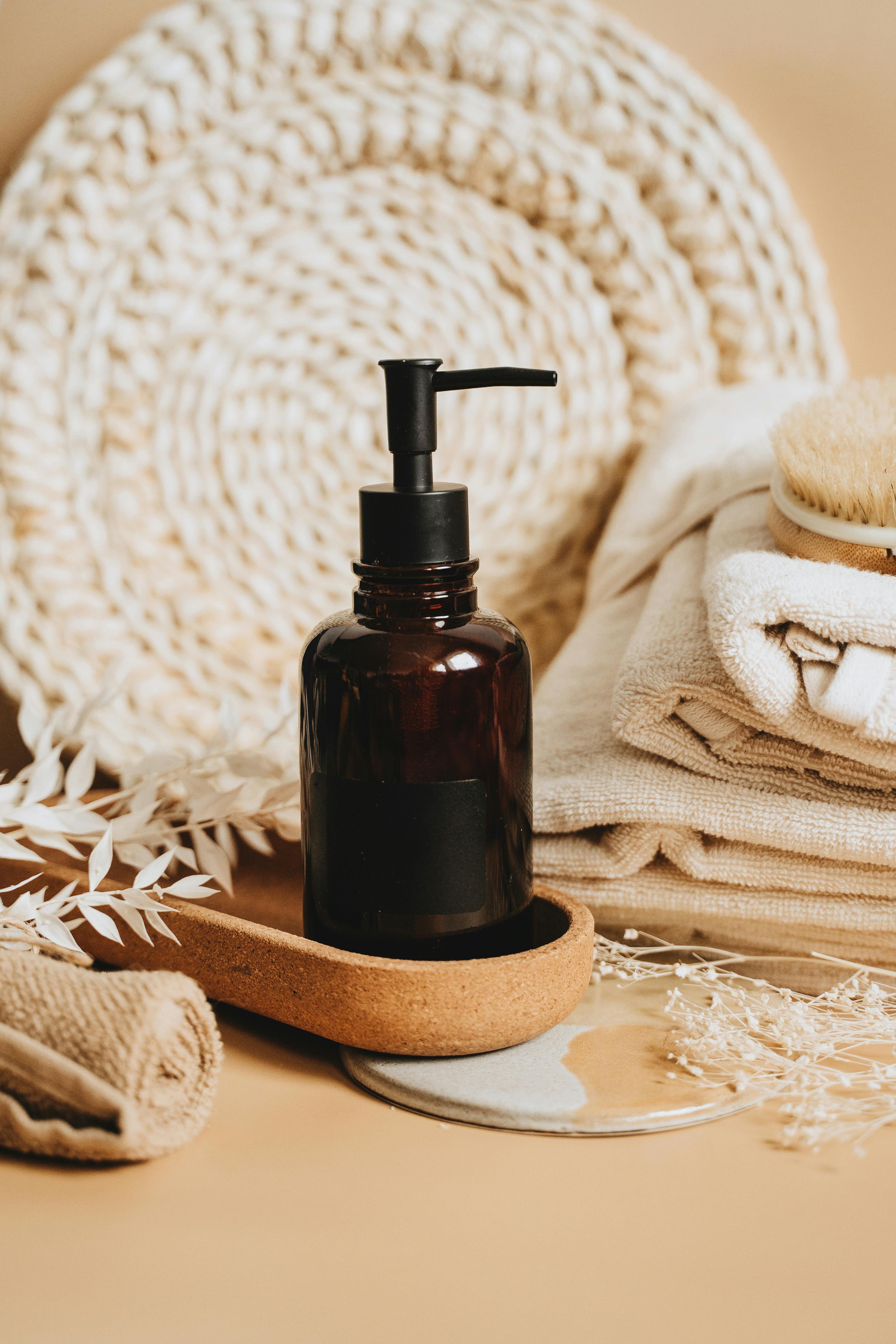 Brown Glass Pump Bottle on Brown Tray · Free Stock Photo