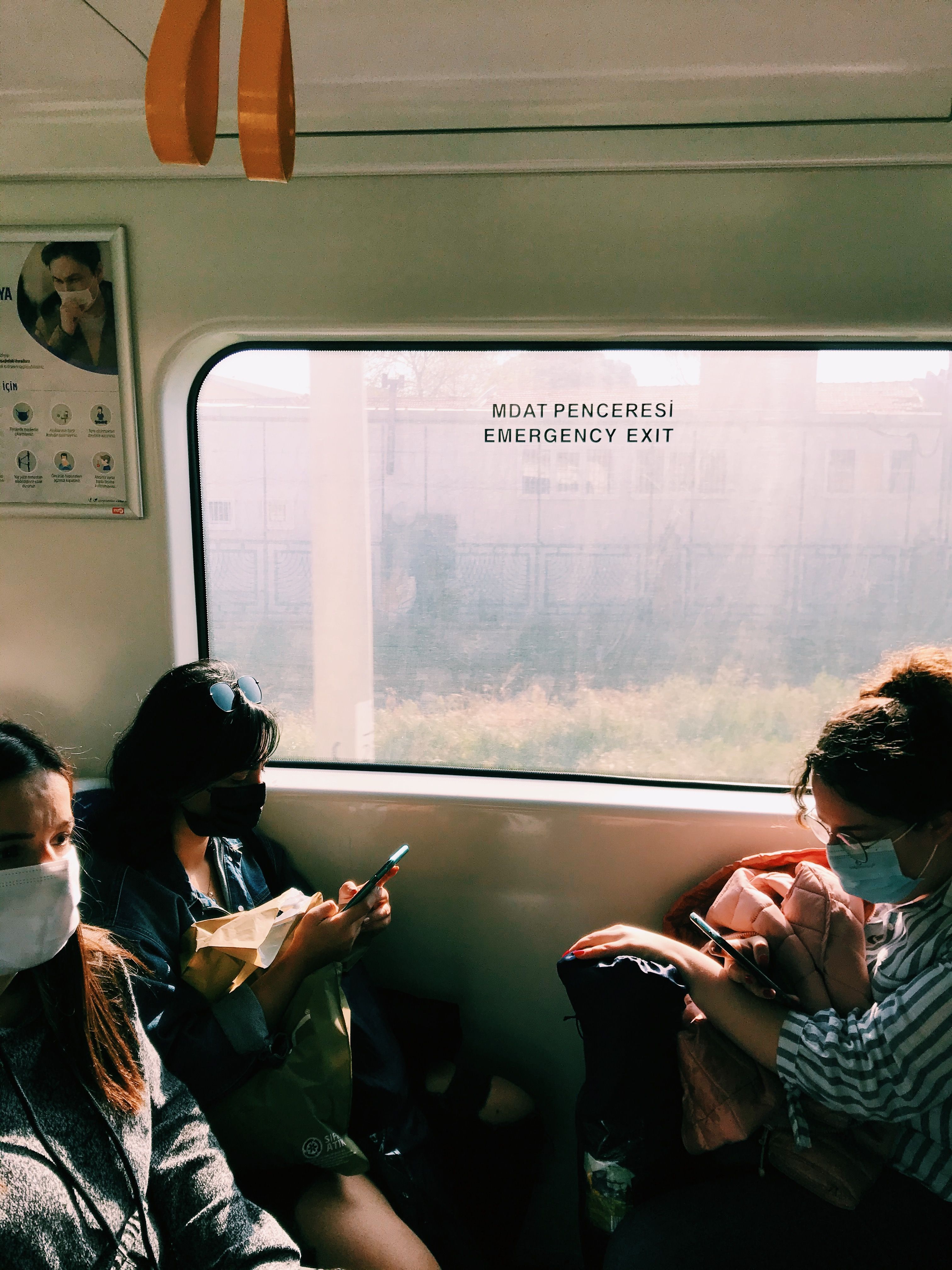 Man Standing While Reading Newspaper in the Train · Free Stock Photo