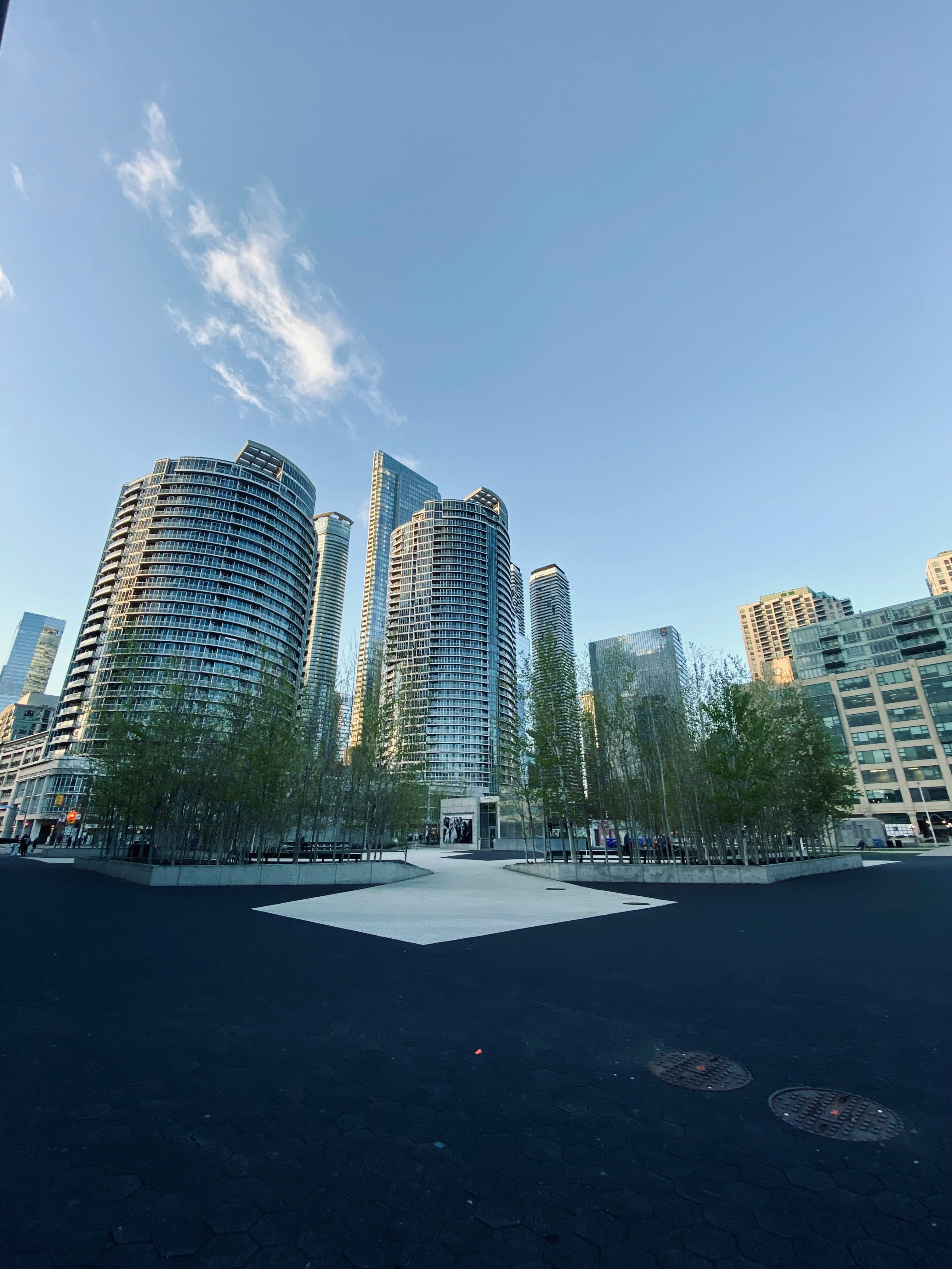 Low Angle Shot of a Modern Downtown with Skyscrapers · Free Stock Photo