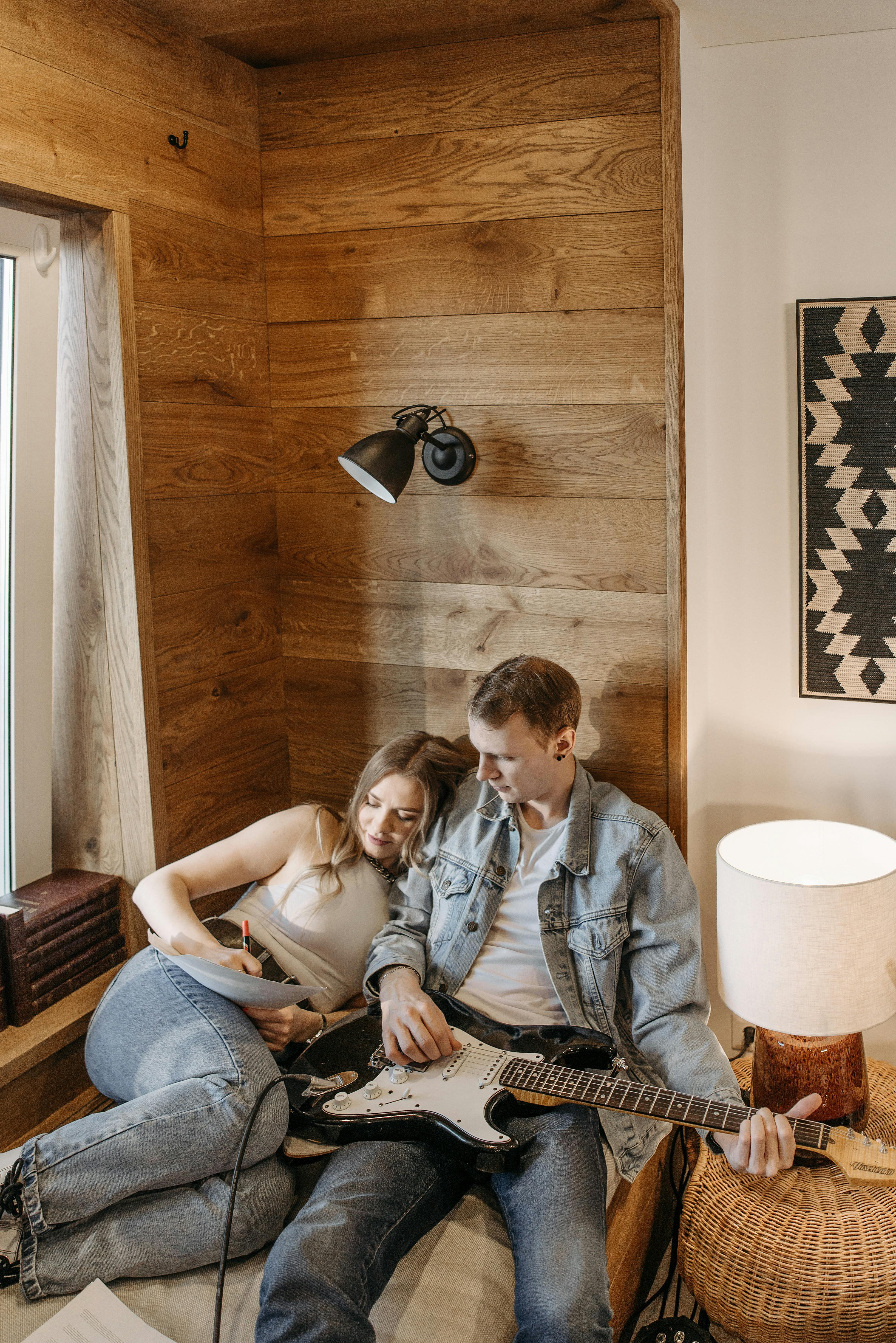 Man and Women Chilling on a Dorm Room · Free Stock Photo