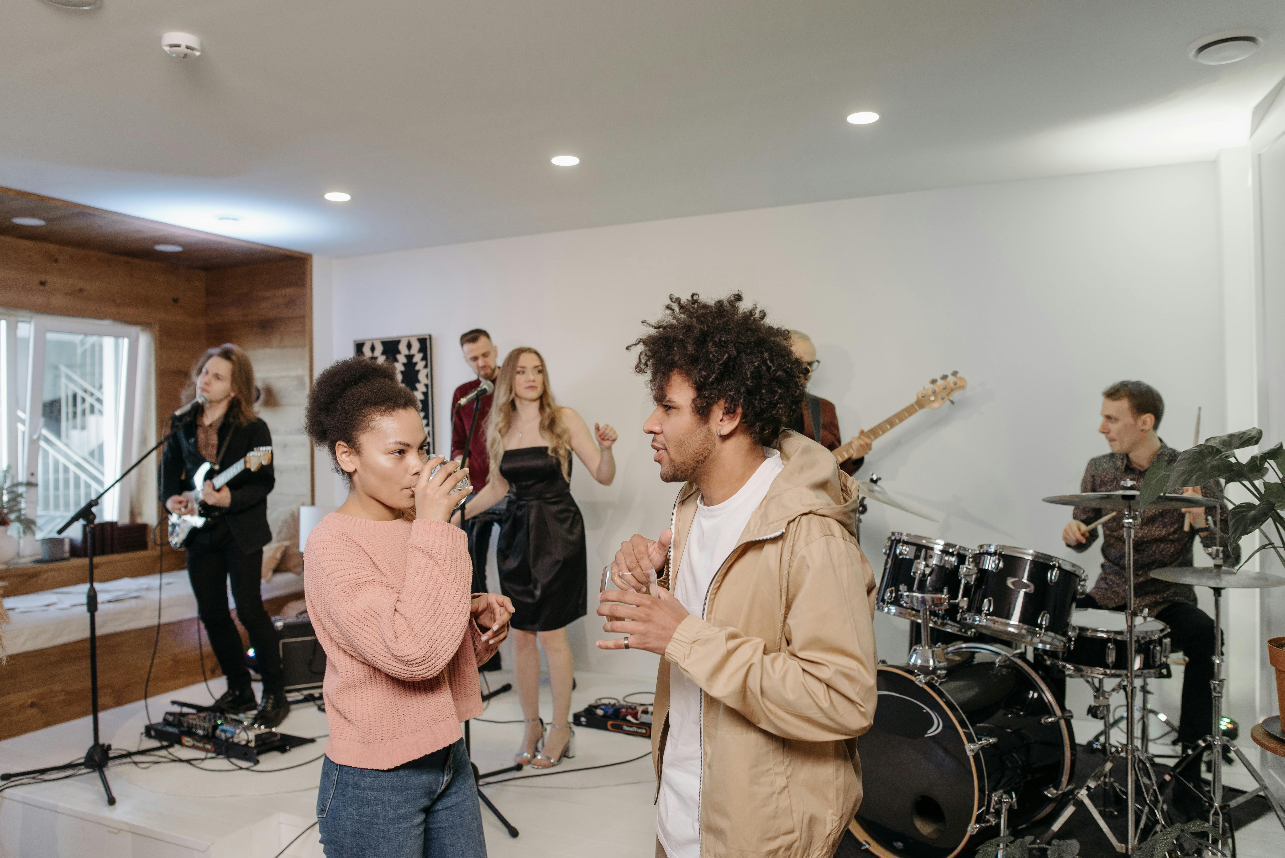 Friends Standing Beside Band on the Stage · Free Stock Photo