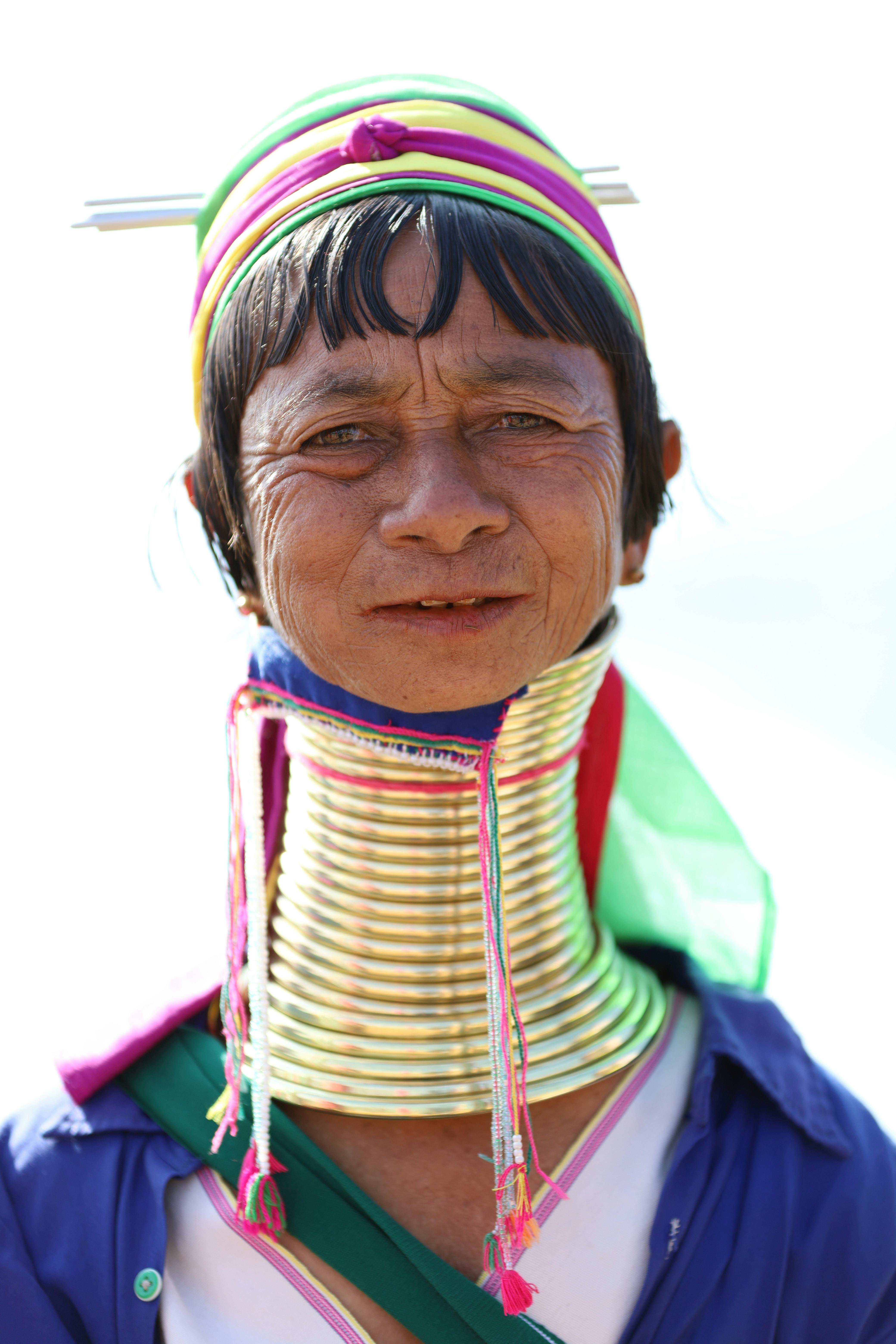 A Portrait of a Woman Wearing Neck Rings · Free Stock Photo