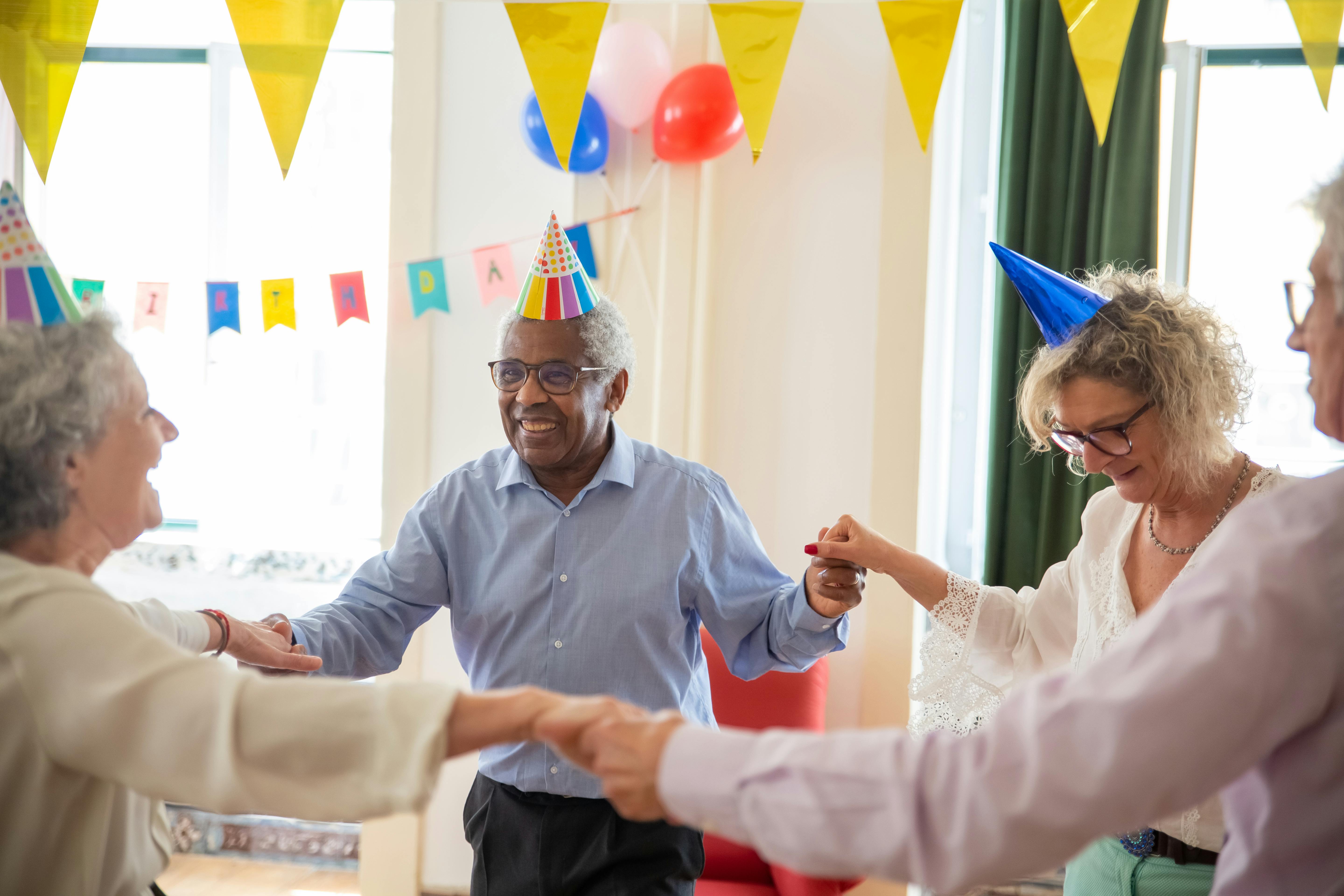 Happy Woman looking at her Birthday Cake · Free Stock Photo