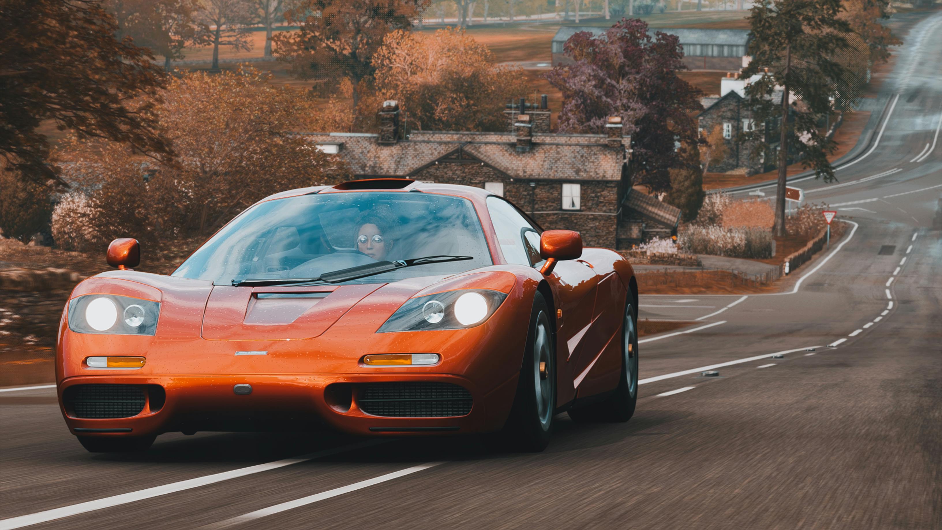 Orange Mclaren Car on the Asphalt Road · Free Stock Photo