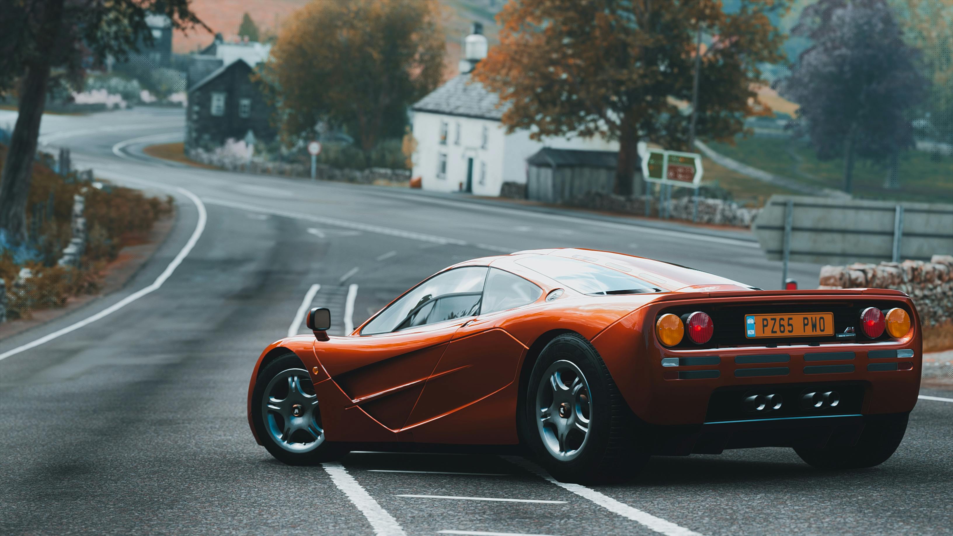 Back View Shot of McLaren F1 LM Parked on the Road · Free Stock Photo