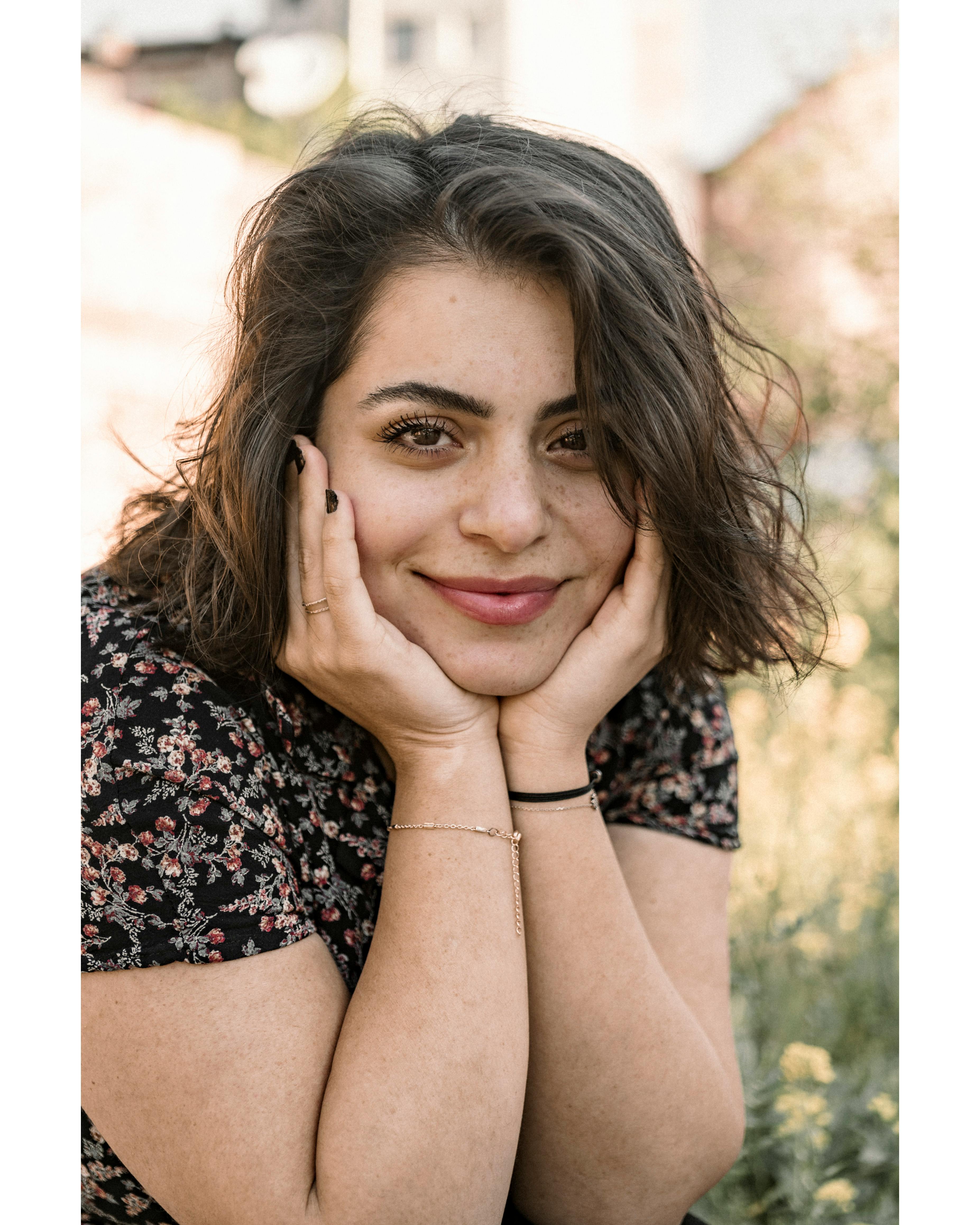 Woman with Her Hands on Her Chin · Free Stock Photo