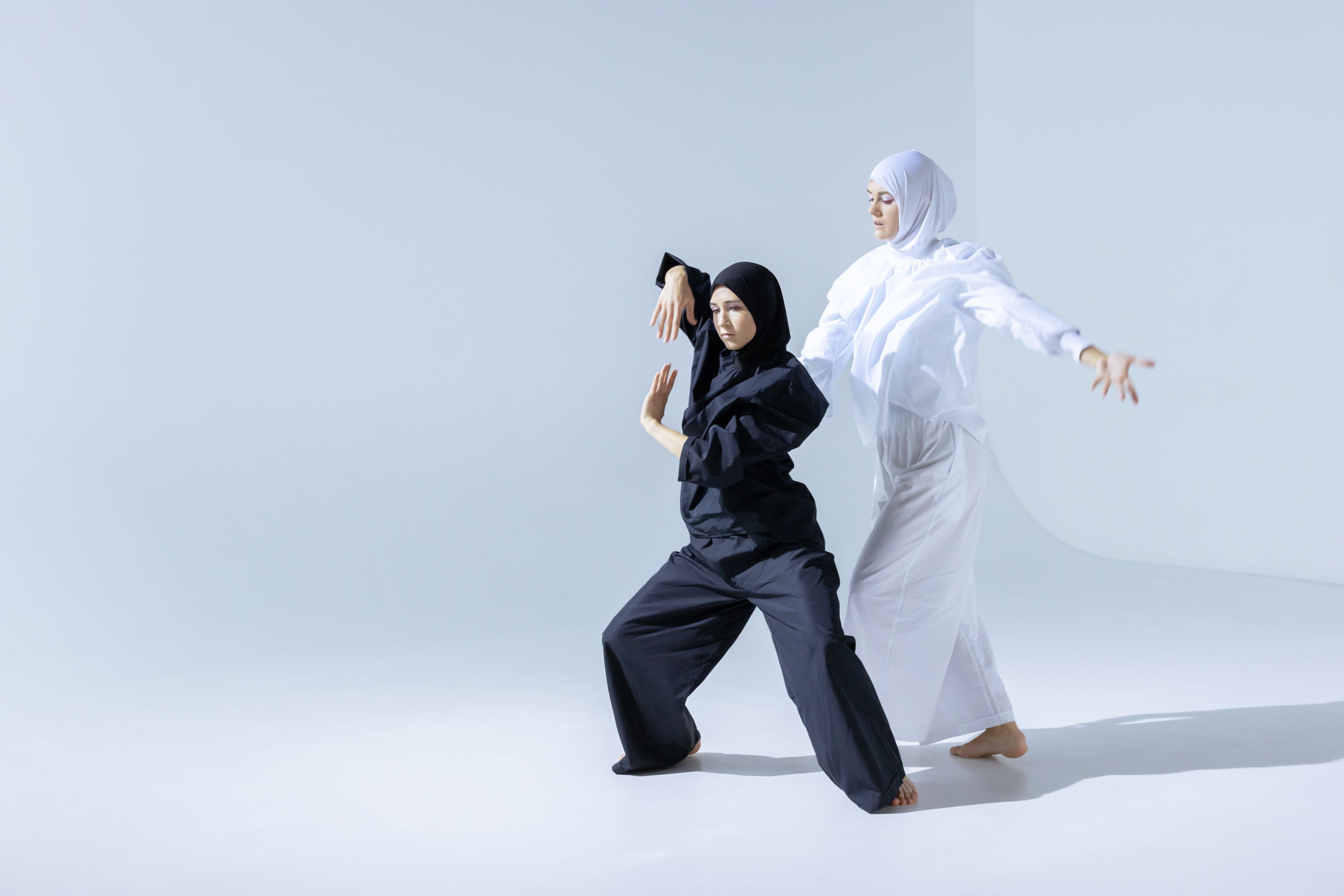 Women in White and Black Hijabs Dancing · Free Stock Photo