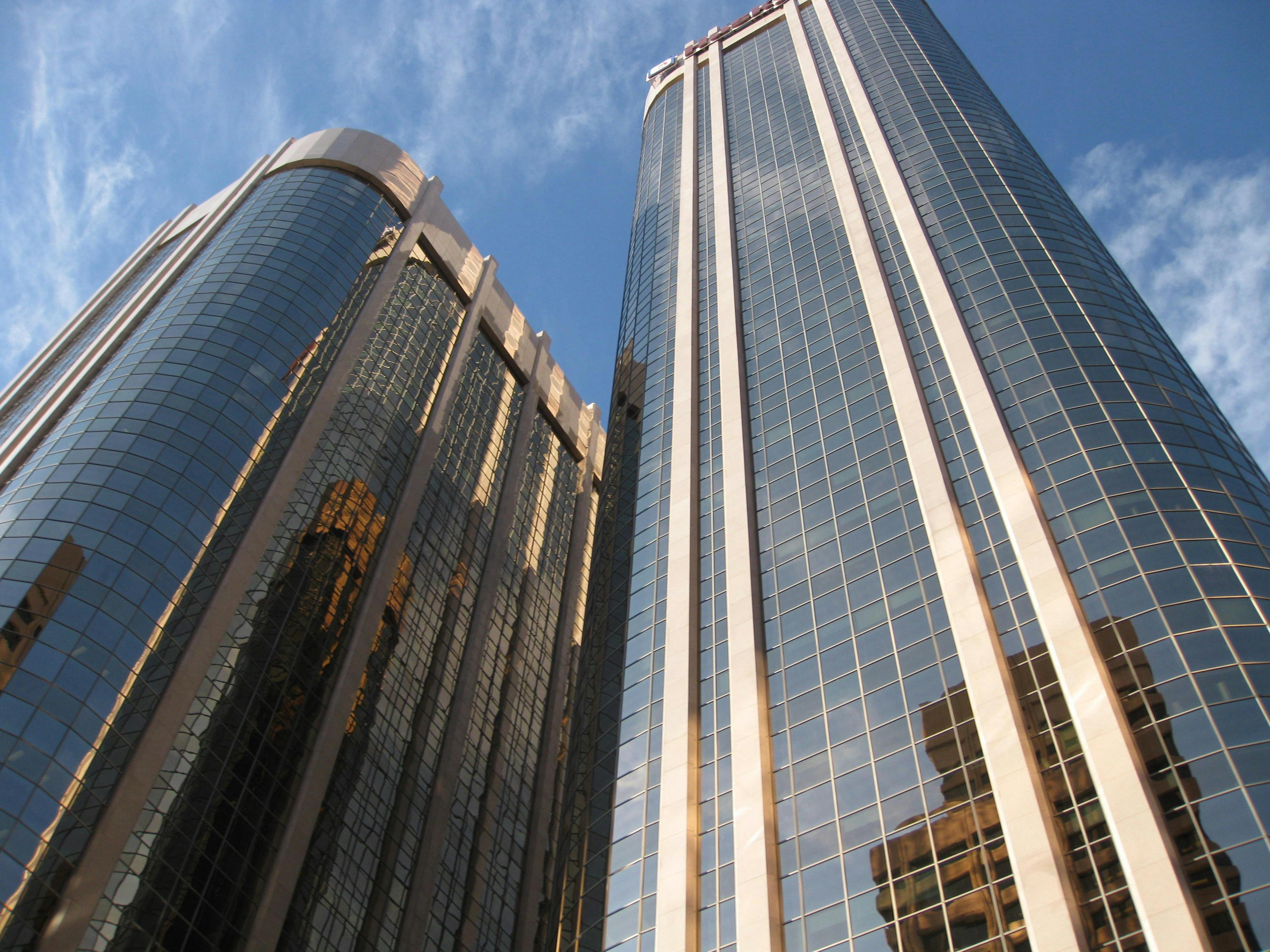 Low-Angle Shot of Two High-Rise Glass Walled Buildings · Free Stock Photo