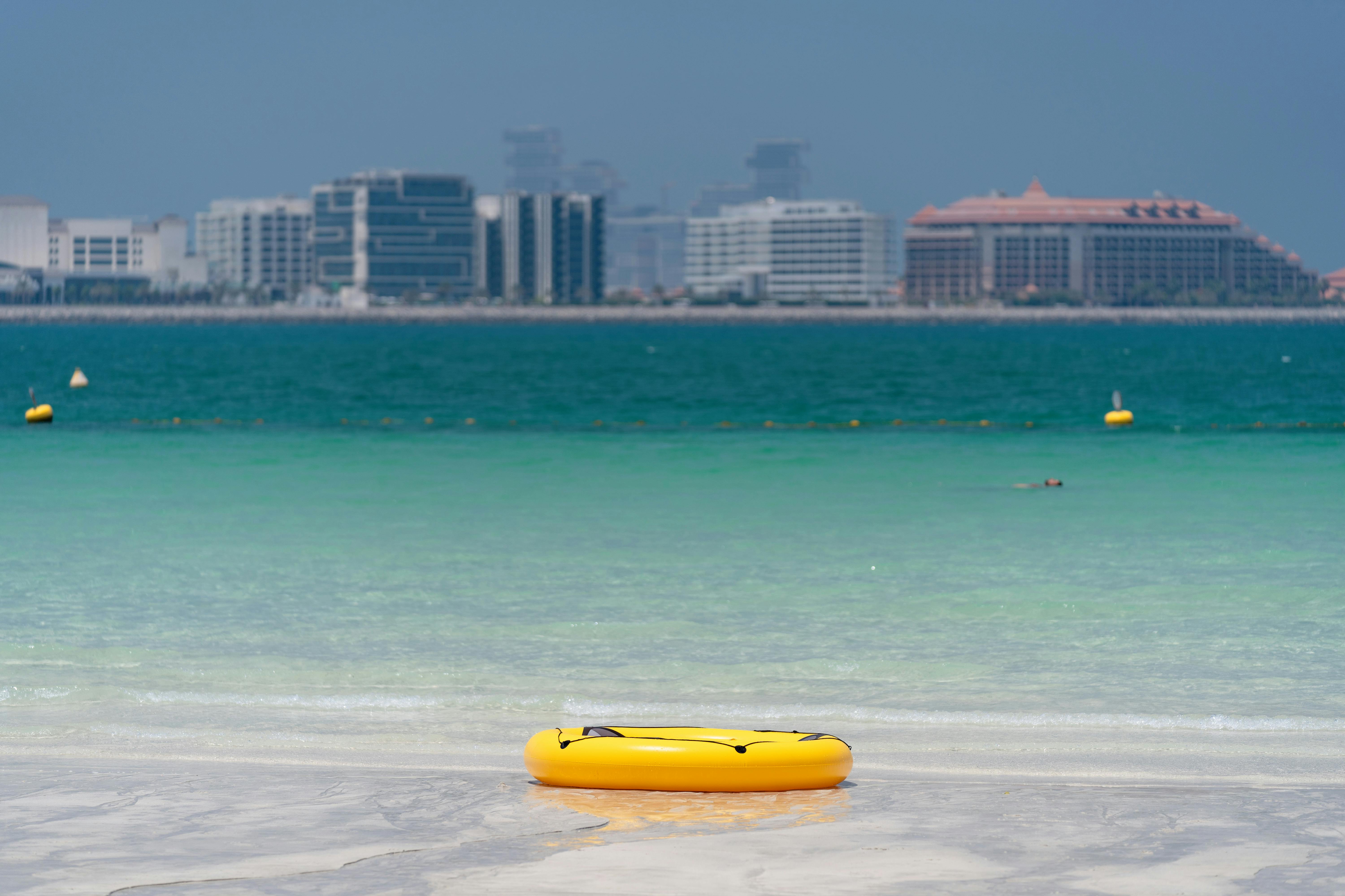 Photo of a Yellow Floater at the Beach · Free Stock Photo