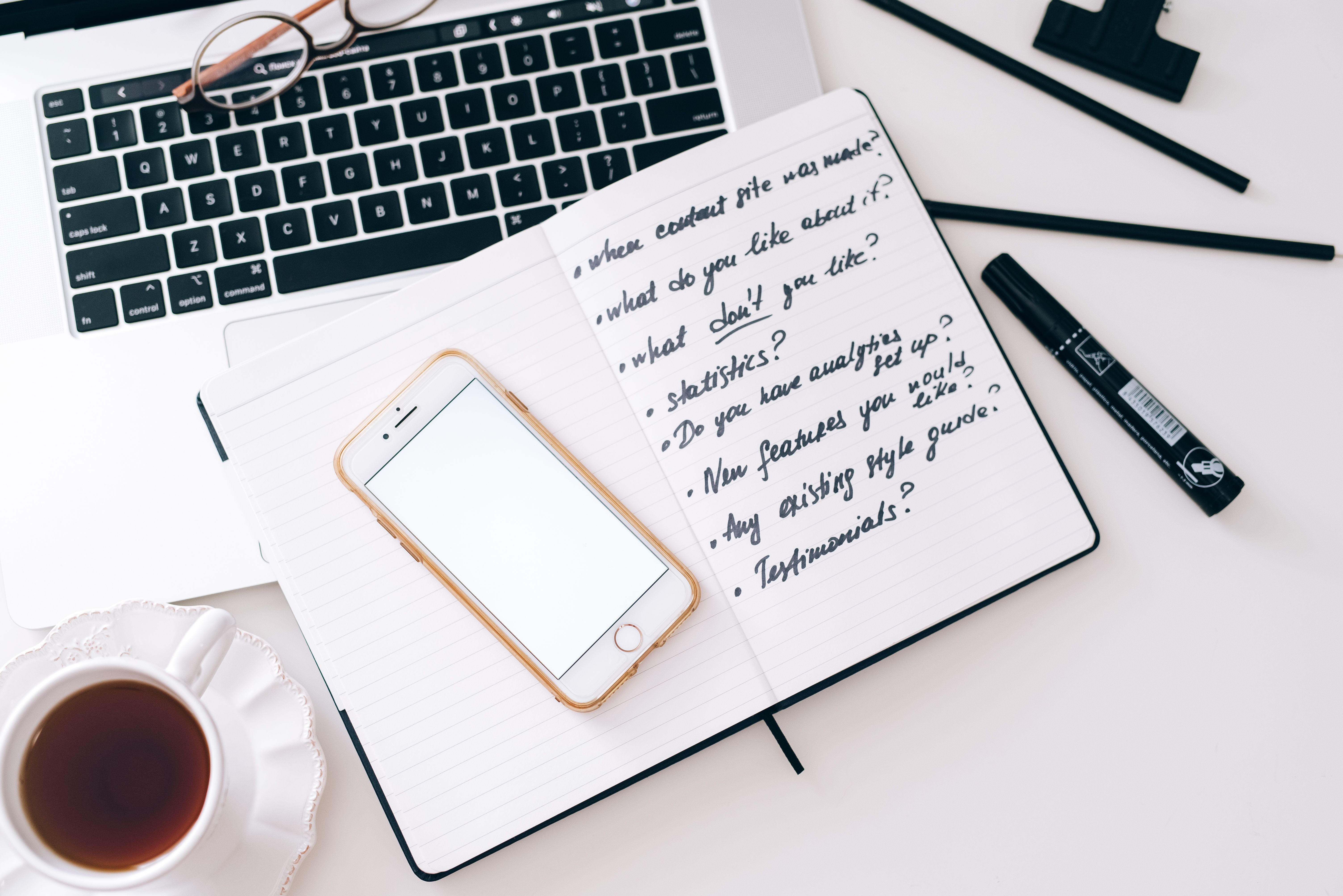 Smartphone on Top of a Notebook · Free Stock Photo