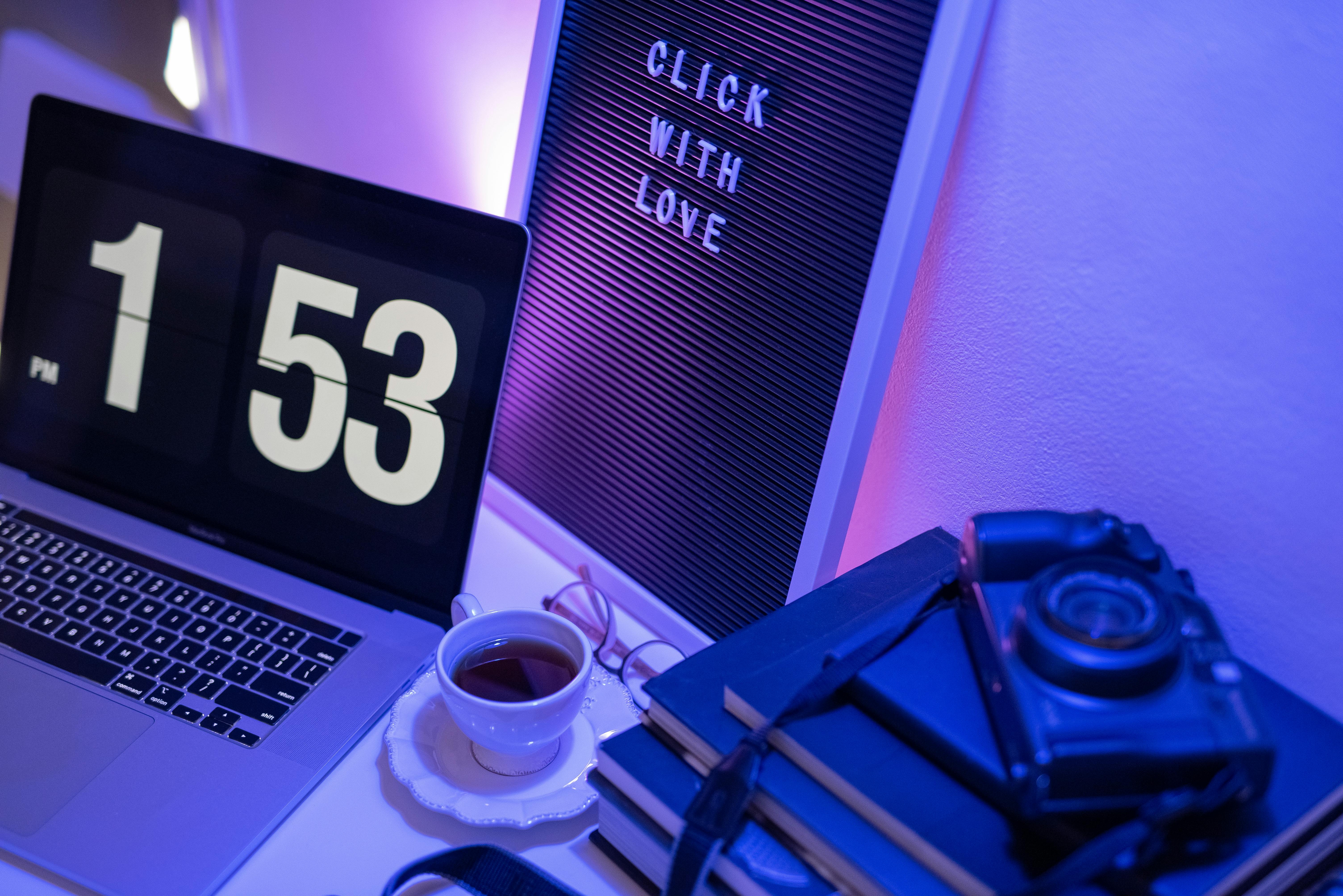 A Laptop beside a Frame · Free Stock Photo