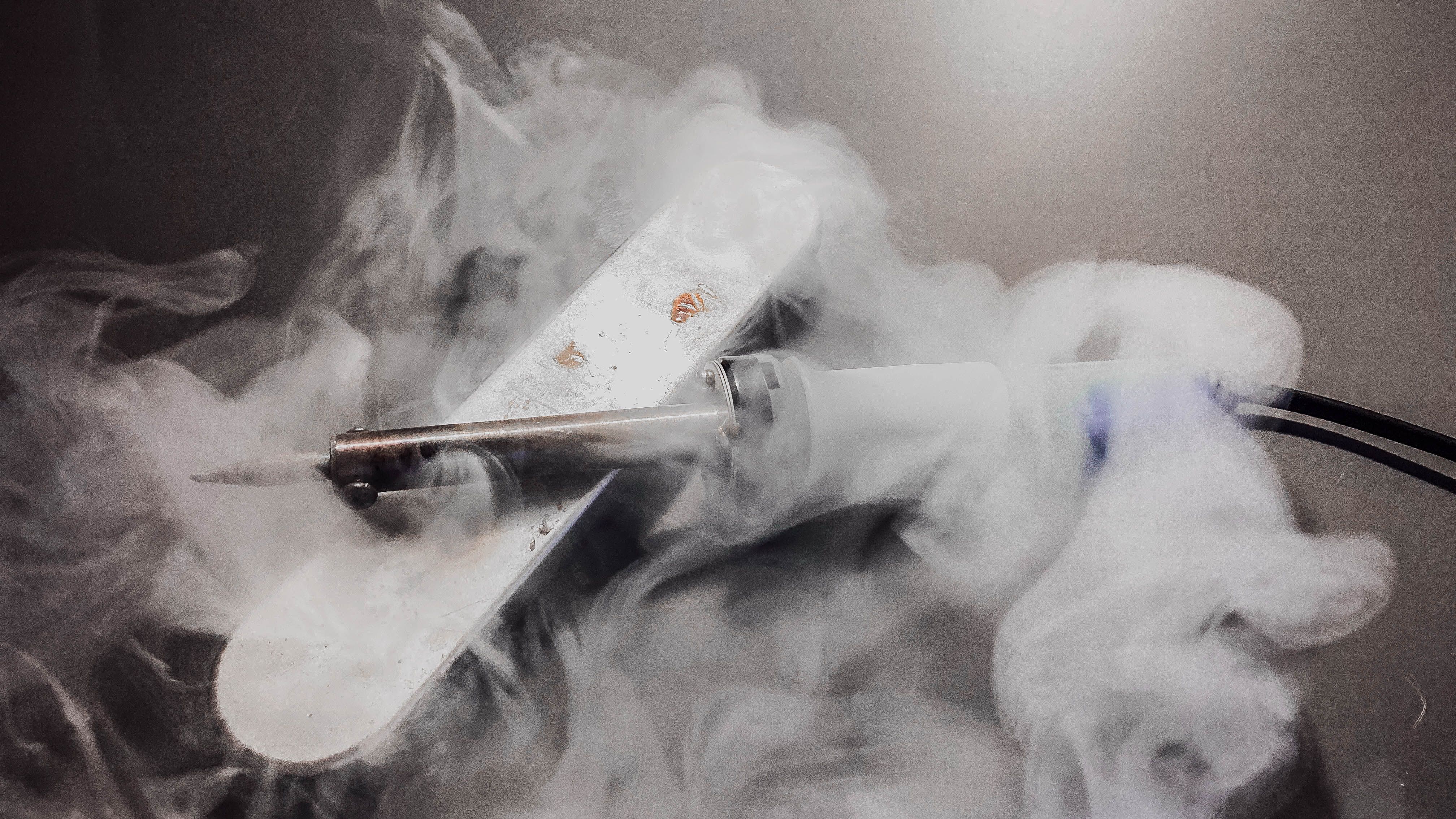 A Person Using a Soldering Iron · Free Stock Photo