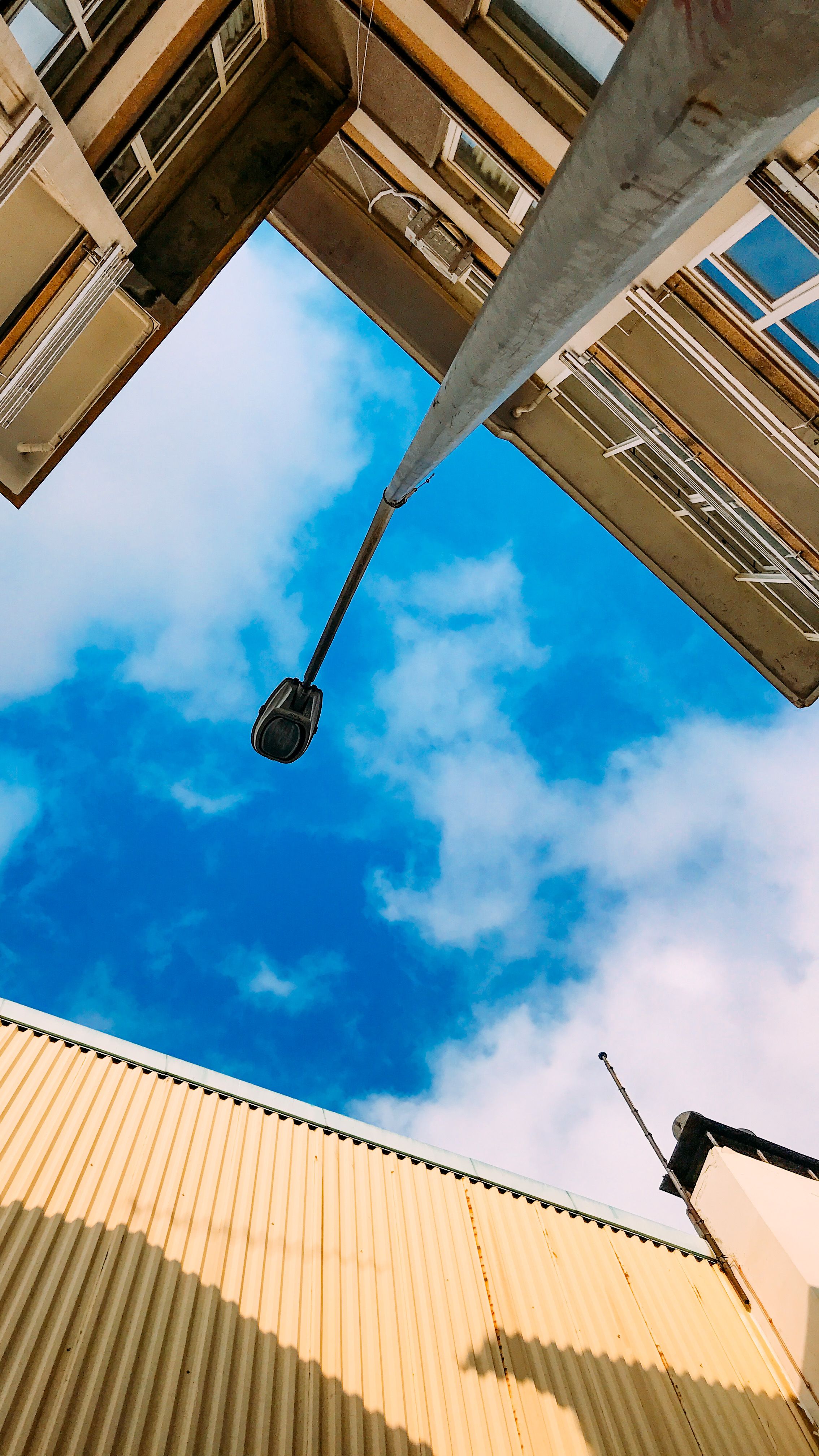 Dark rainy sky over building · Free Stock Photo