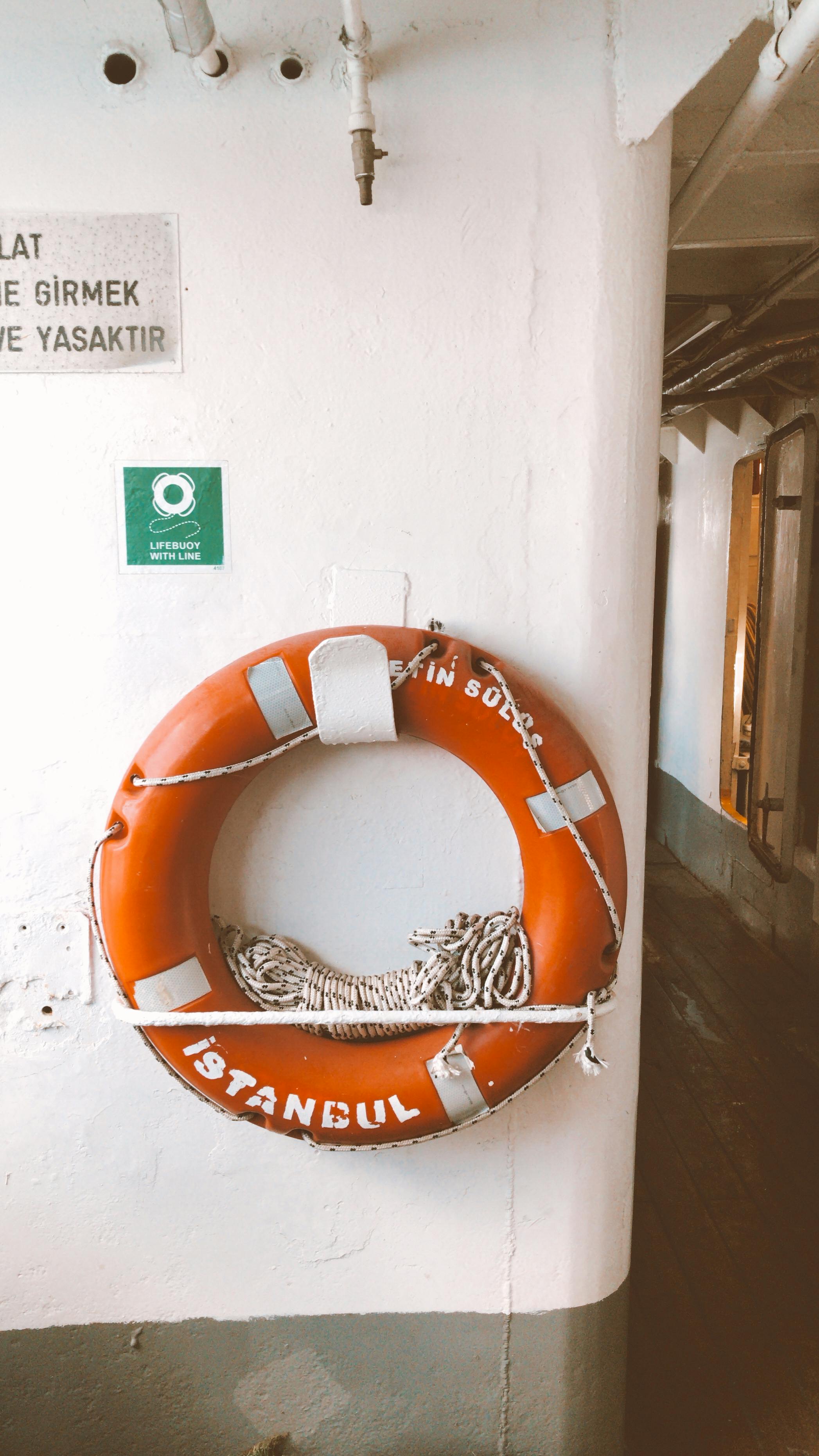 Orange Floater Hanging on the Wall · Free Stock Photo