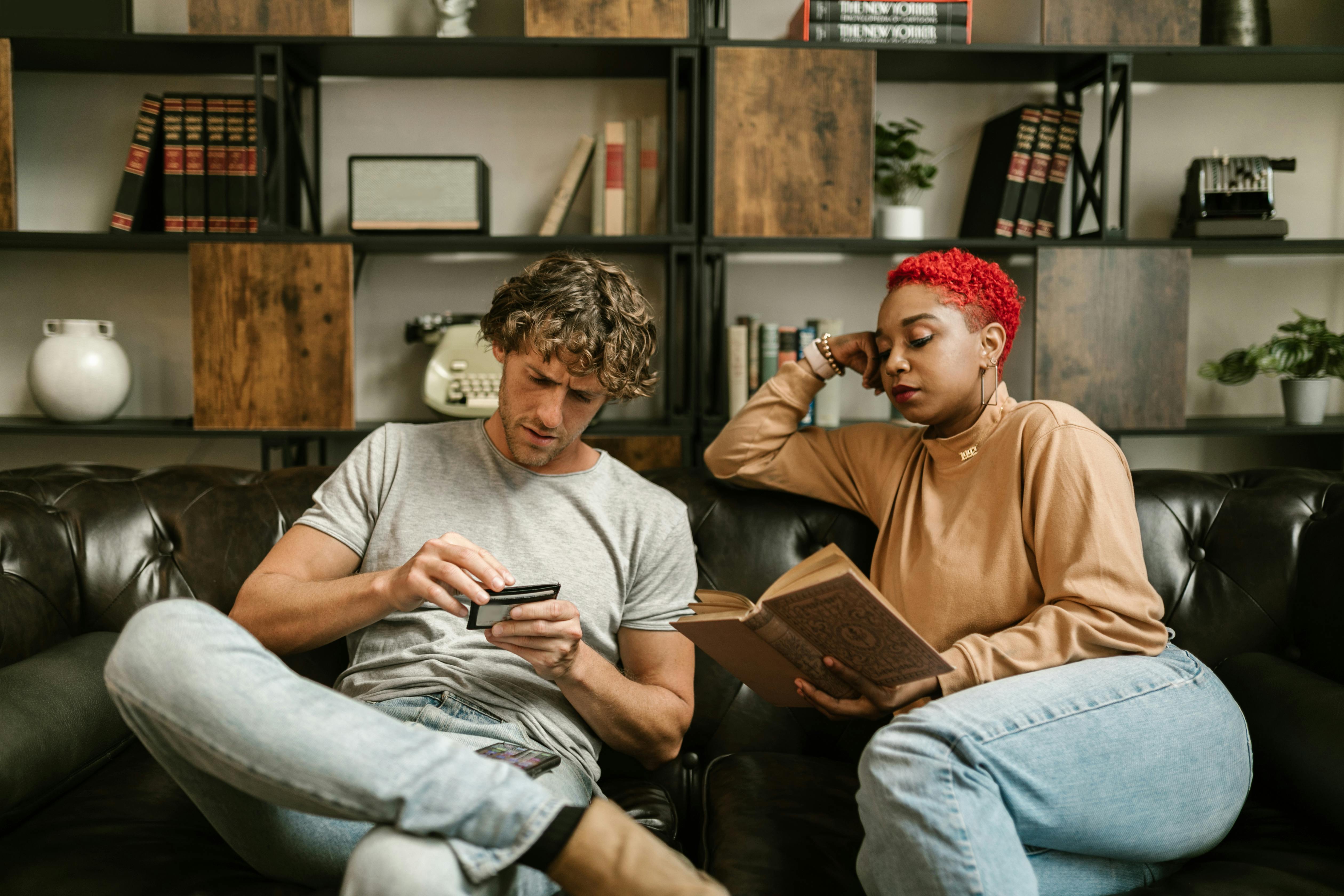 Woman in White Tank Top and Black Short Sitting on Brown Sofa · Free ...