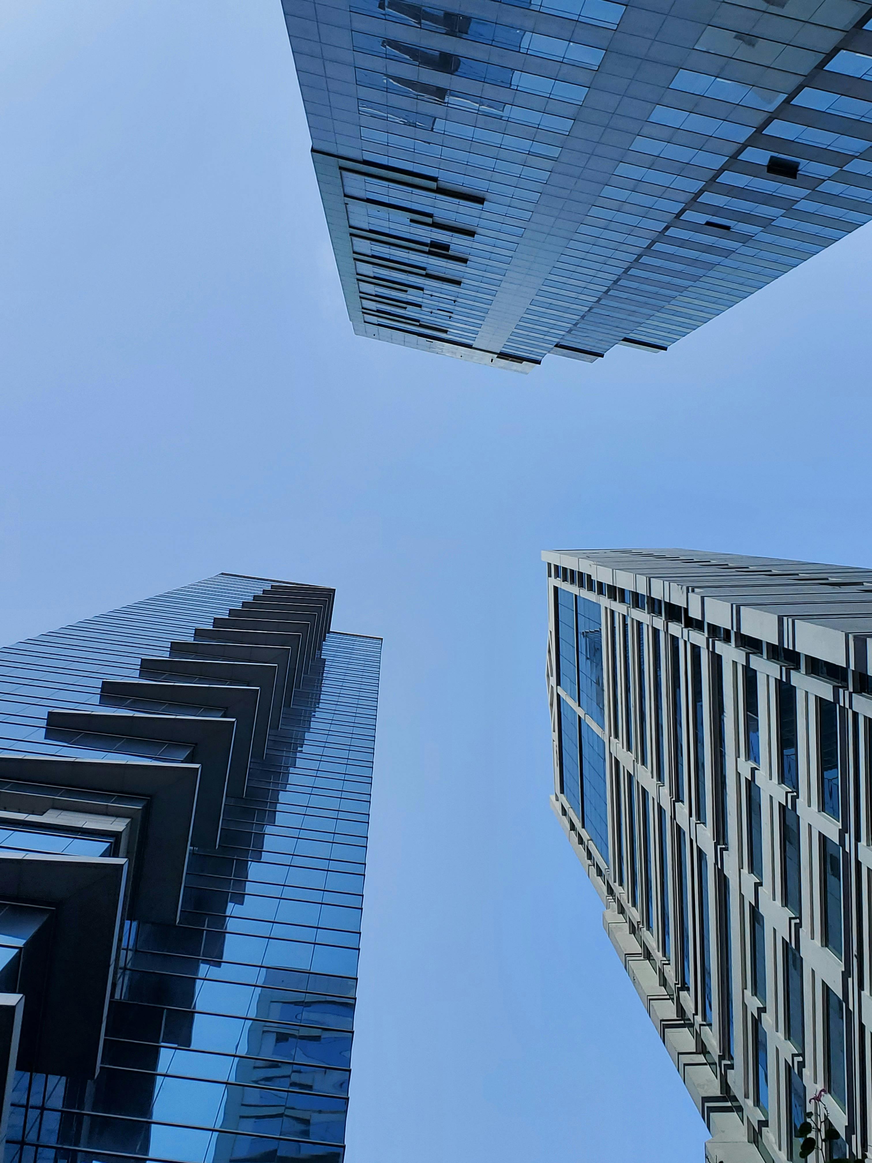 High Rise Buildings Across the Blue Sky · Free Stock Photo