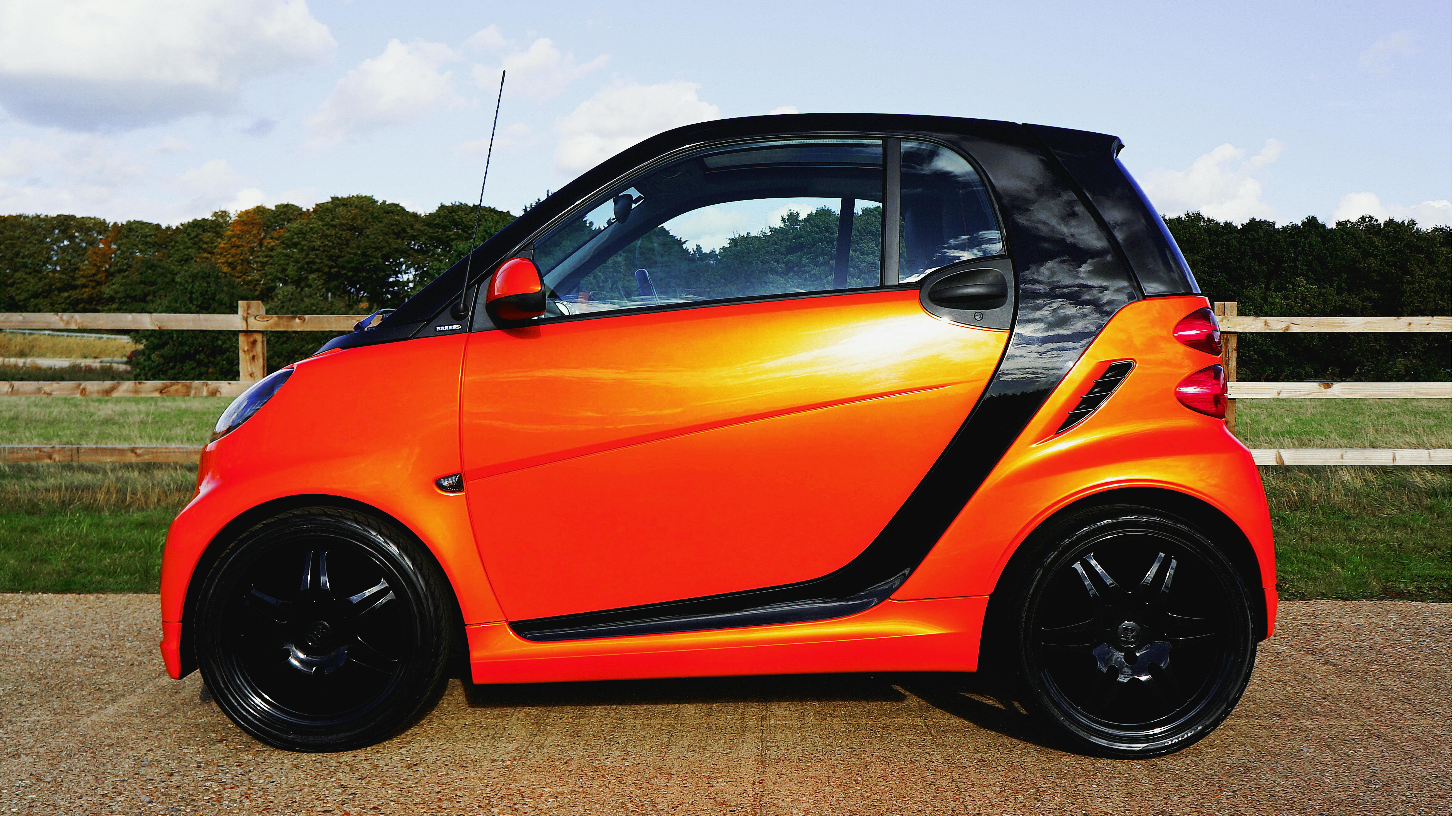 Orange Microcar Parked on the Road · Free Stock Photo