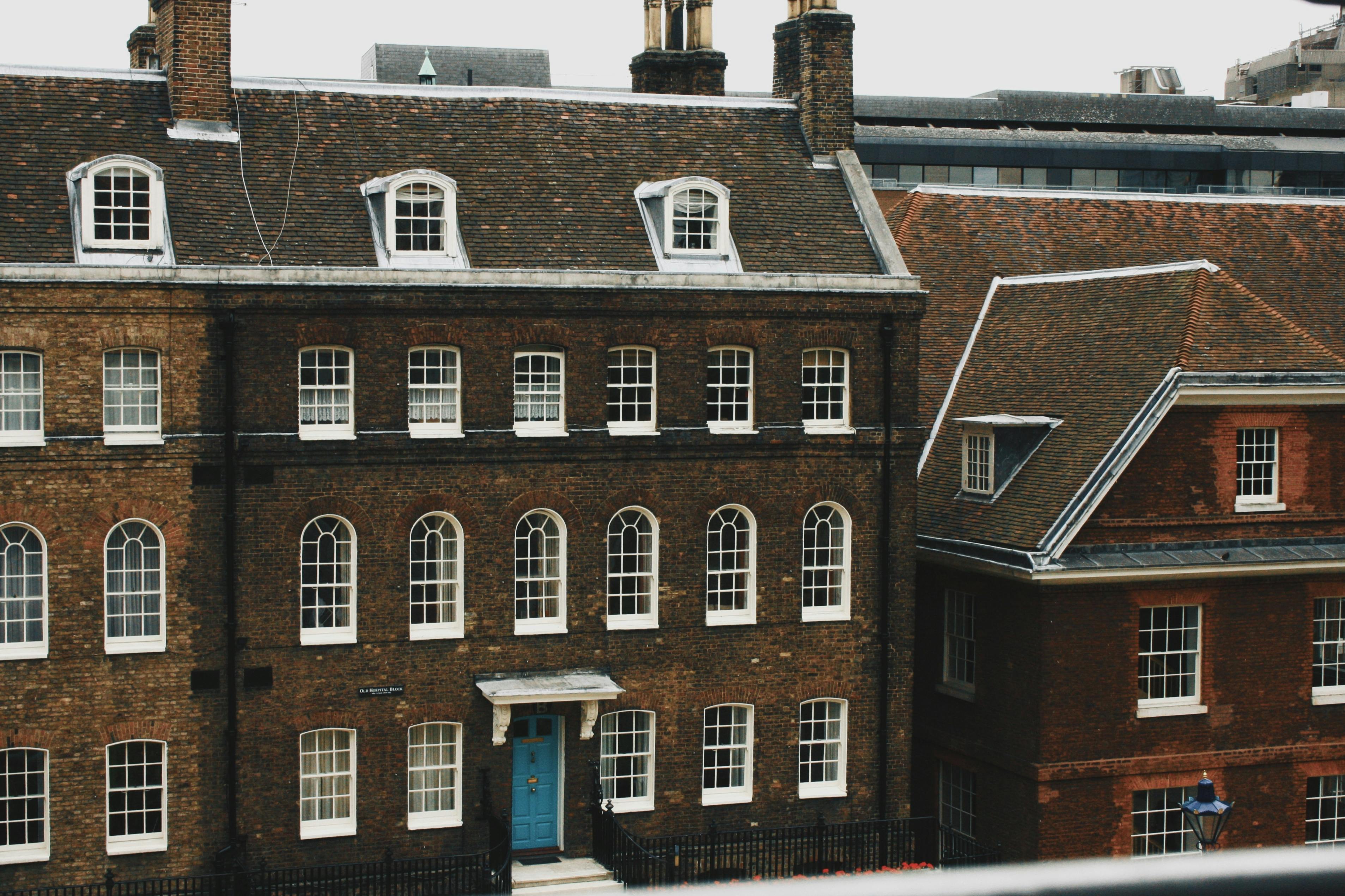 Brown Brick Buildings with White Windows · Free Stock Photo