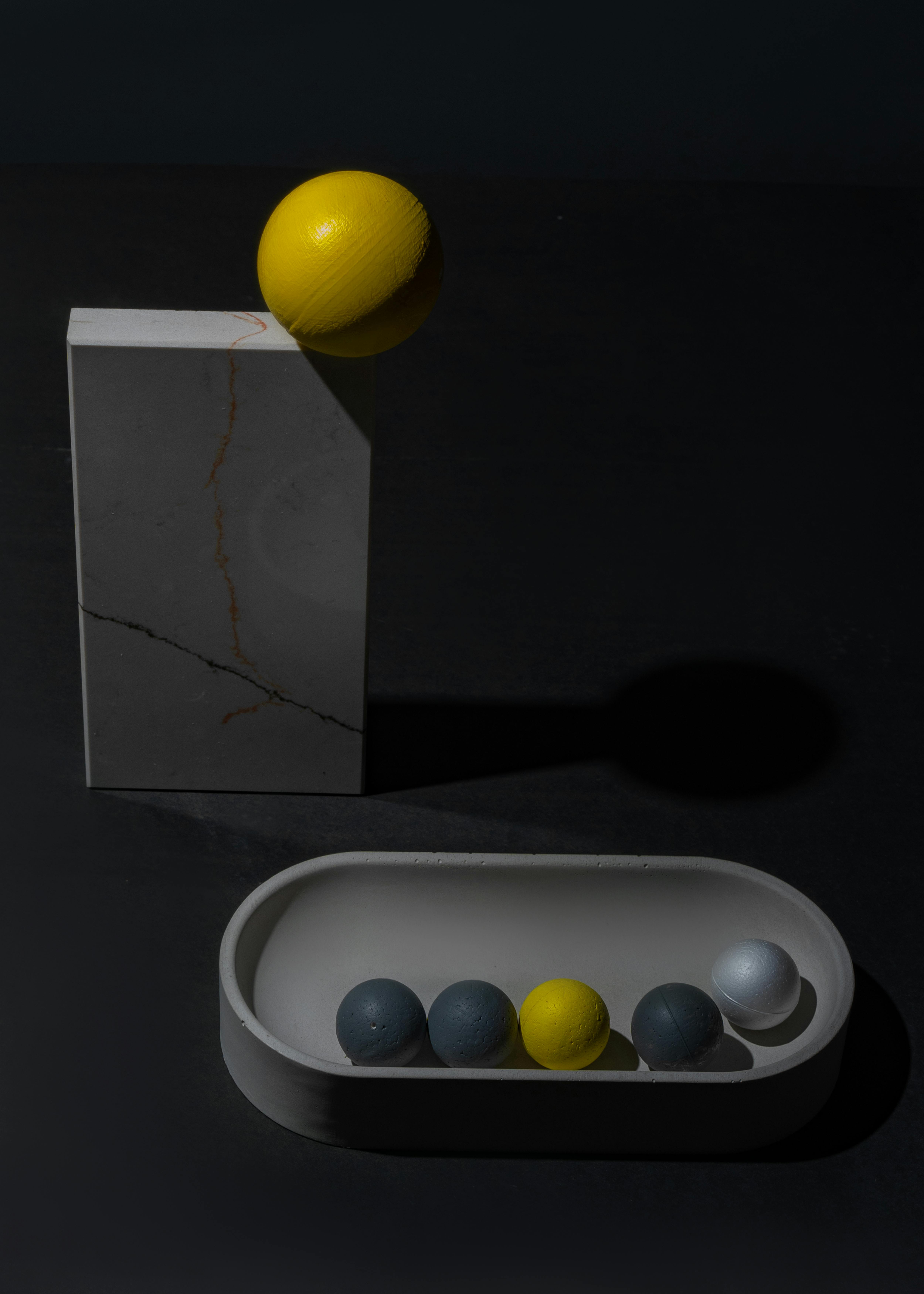 Still Life Composition with Gray and Yellow Elements · Free Stock Photo