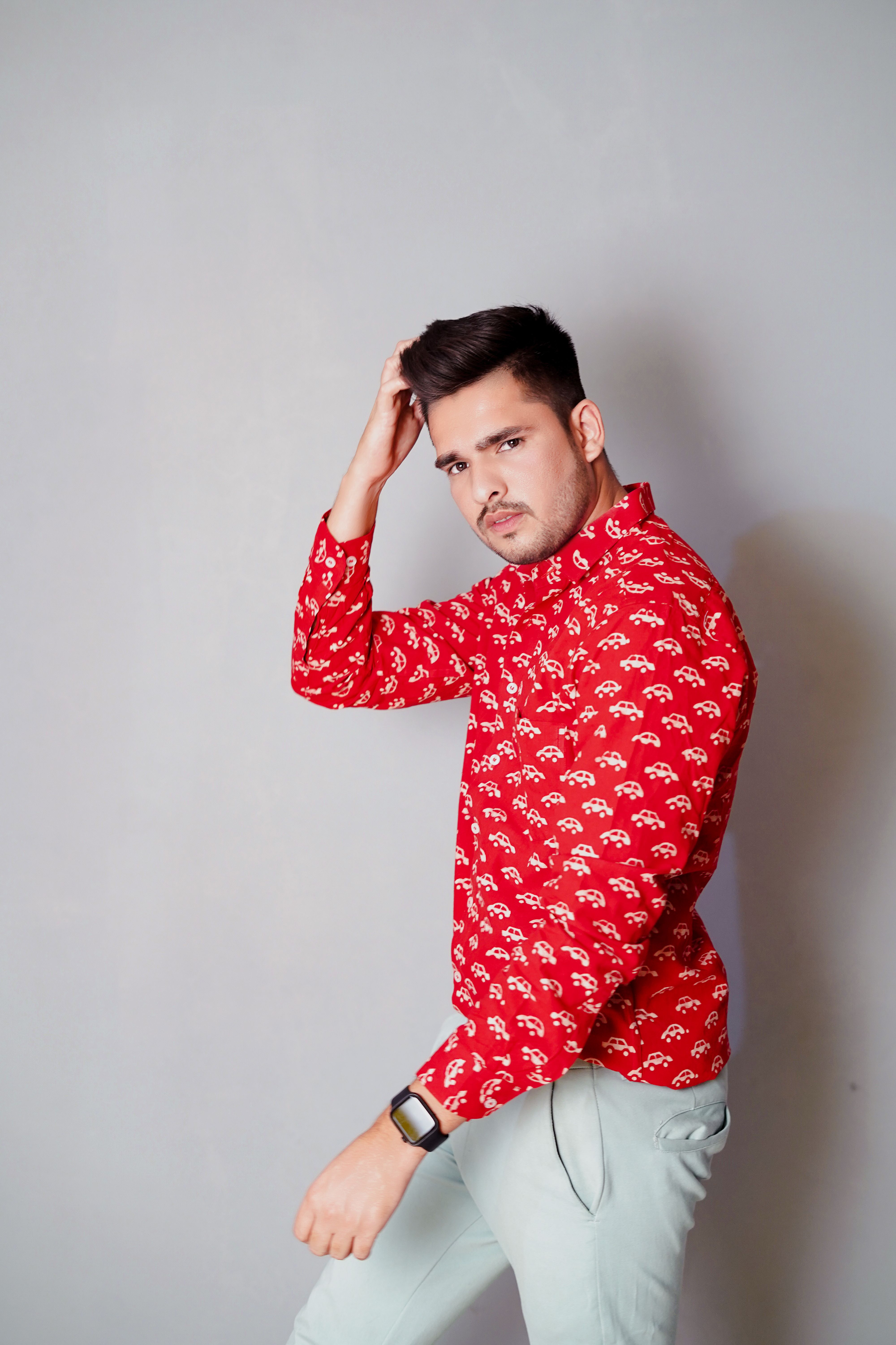 Man Biting a Flower While Sitting on a Chair · Free Stock Photo