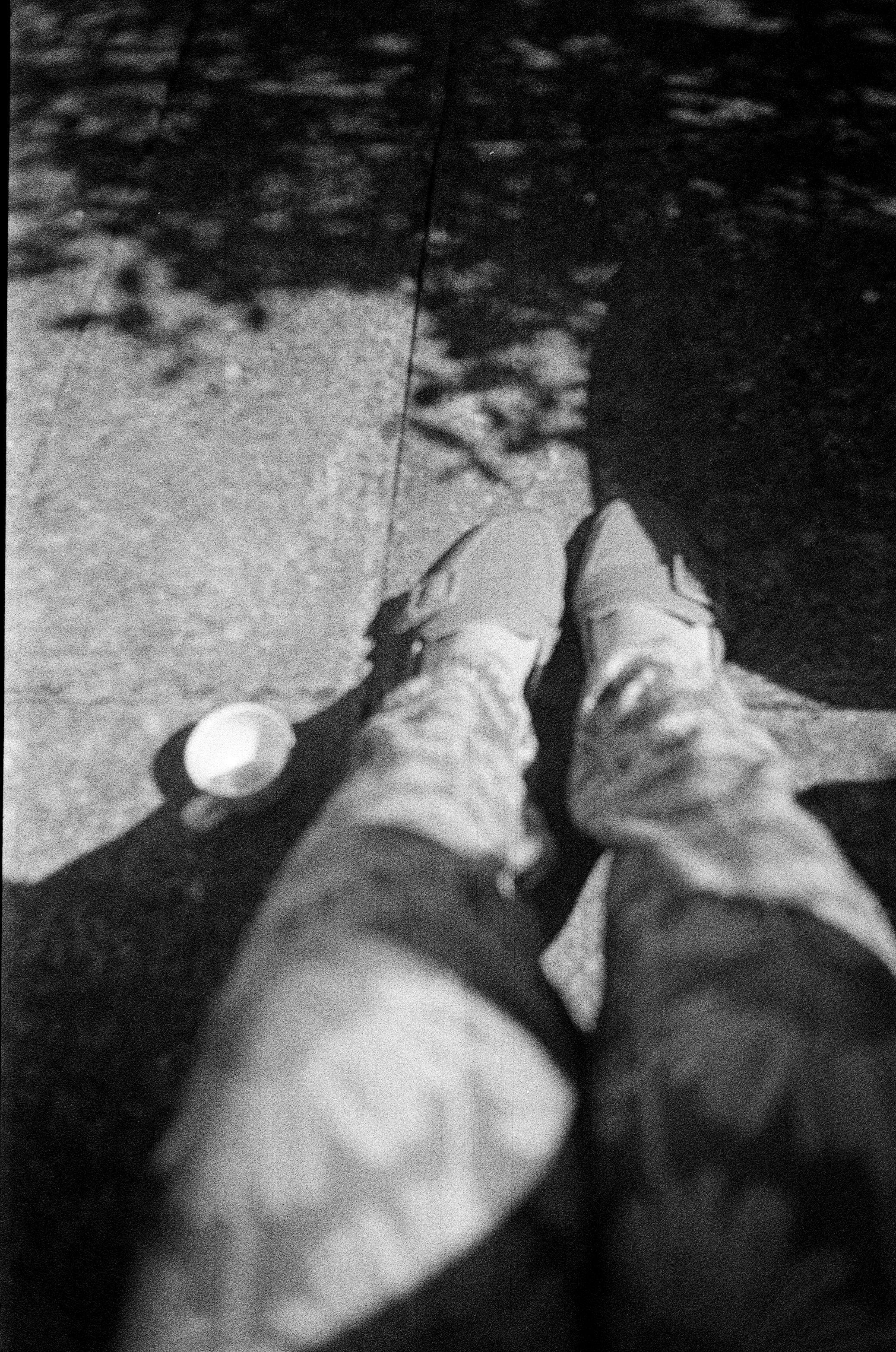 Legs with Cup on Sidewalk · Free Stock Photo