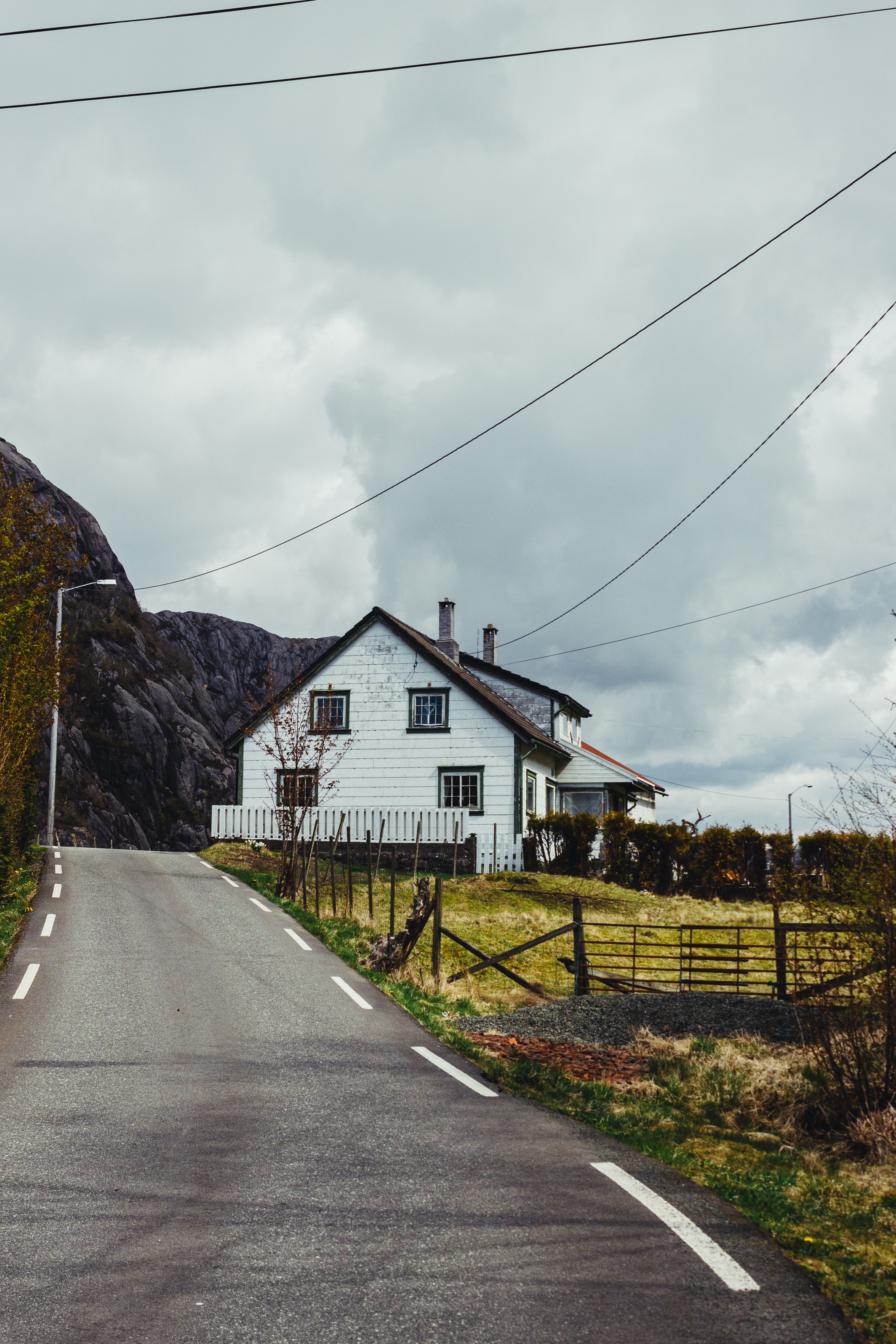 A Beautiful White Wooden House on the Side of the Street · Free Stock Photo