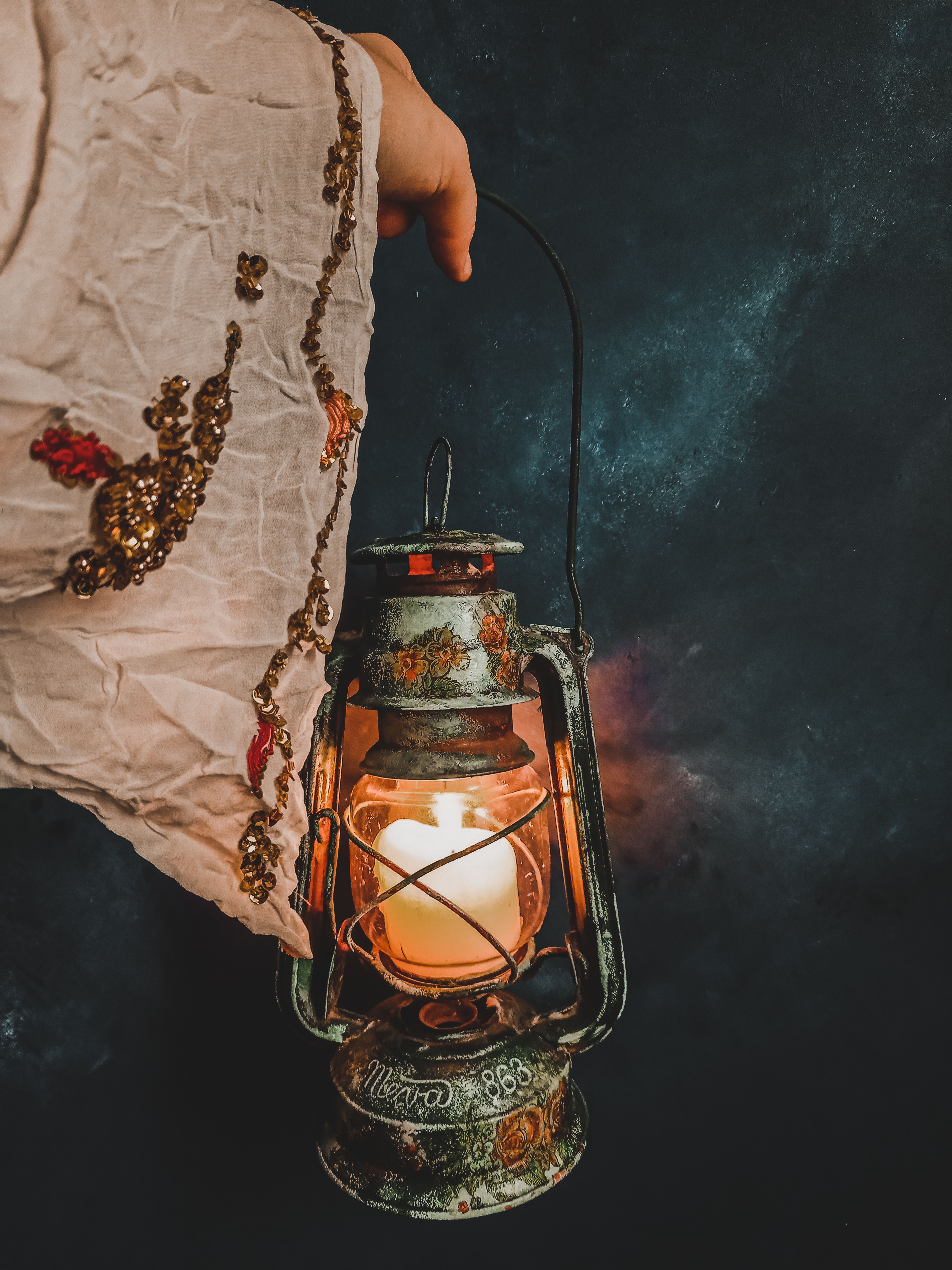 Close-Up Shot of a Person Holding a Lamp · Free Stock Photo