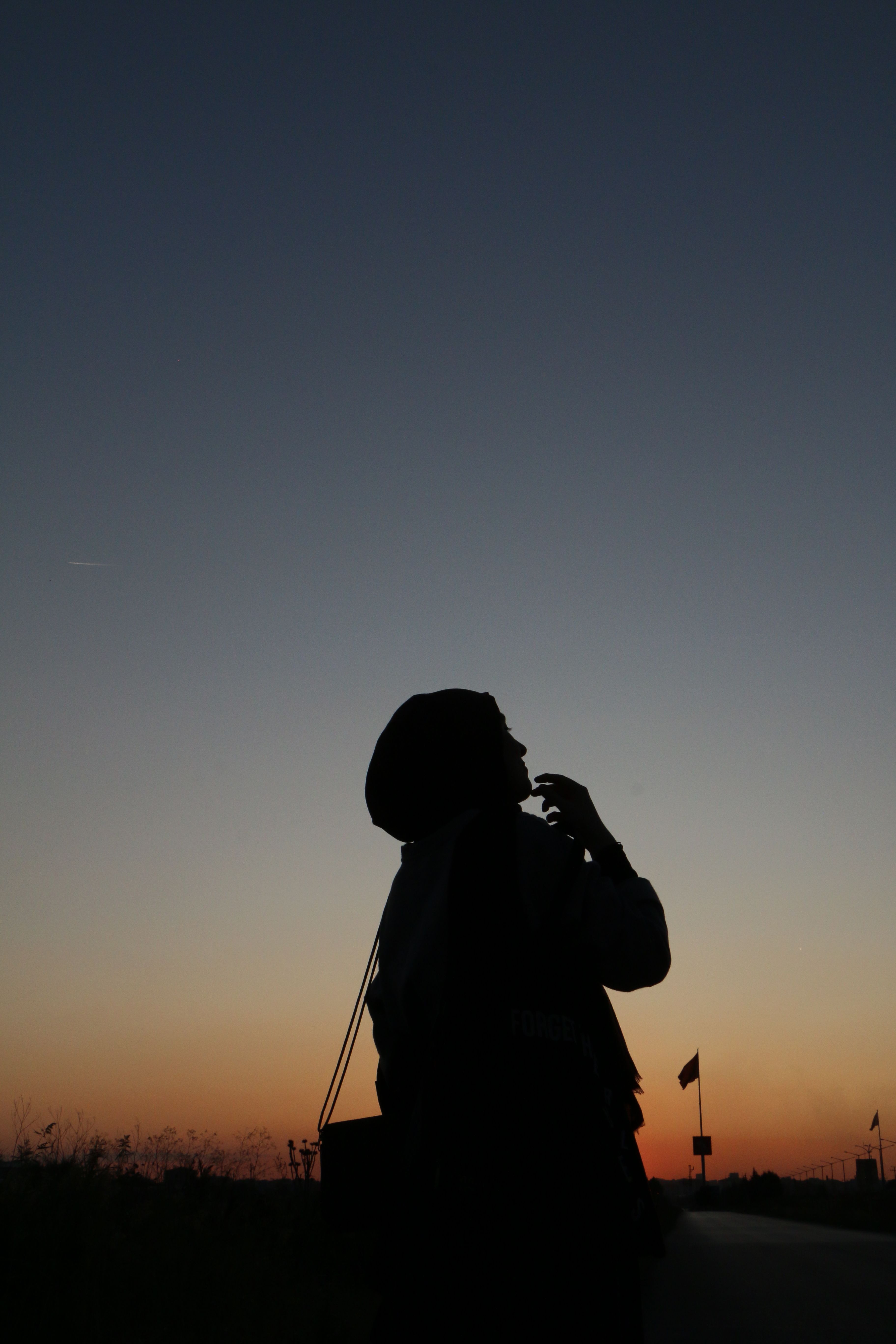 Person admiring scenery of sunset sky · Free Stock Photo