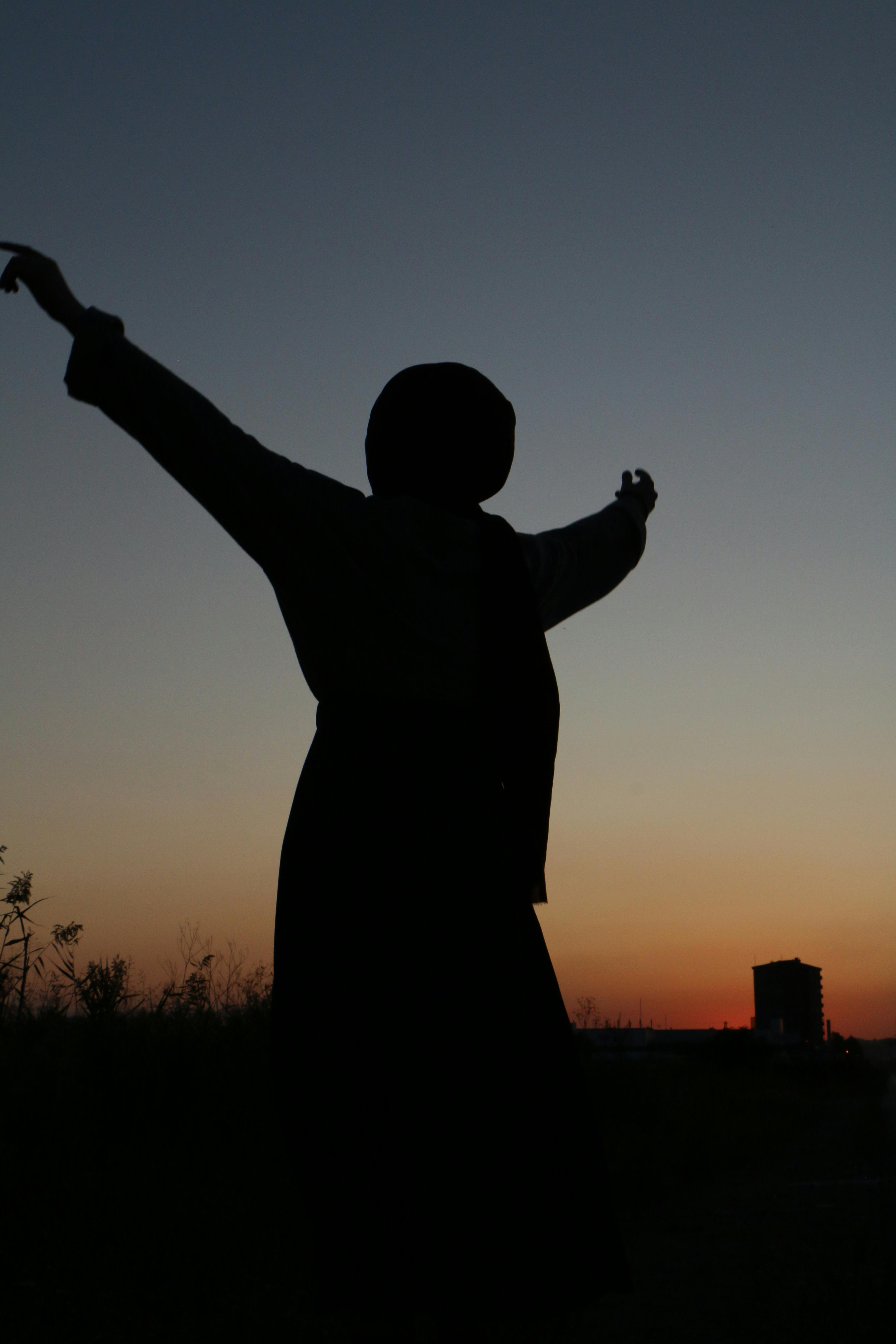 Person admiring scenery of sunset sky · Free Stock Photo
