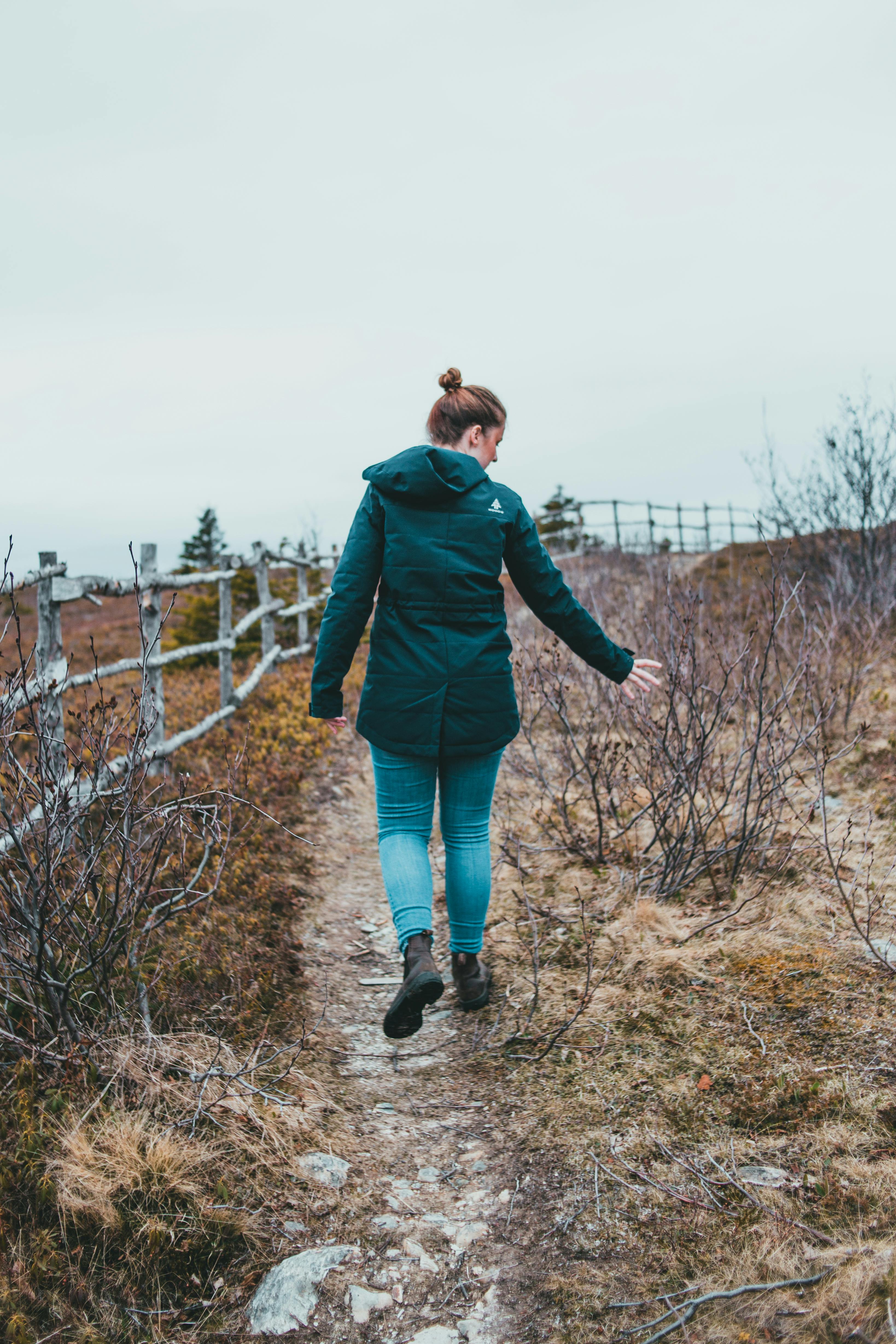 Person Carrying Backpack Walking on a Path · Free Stock Photo