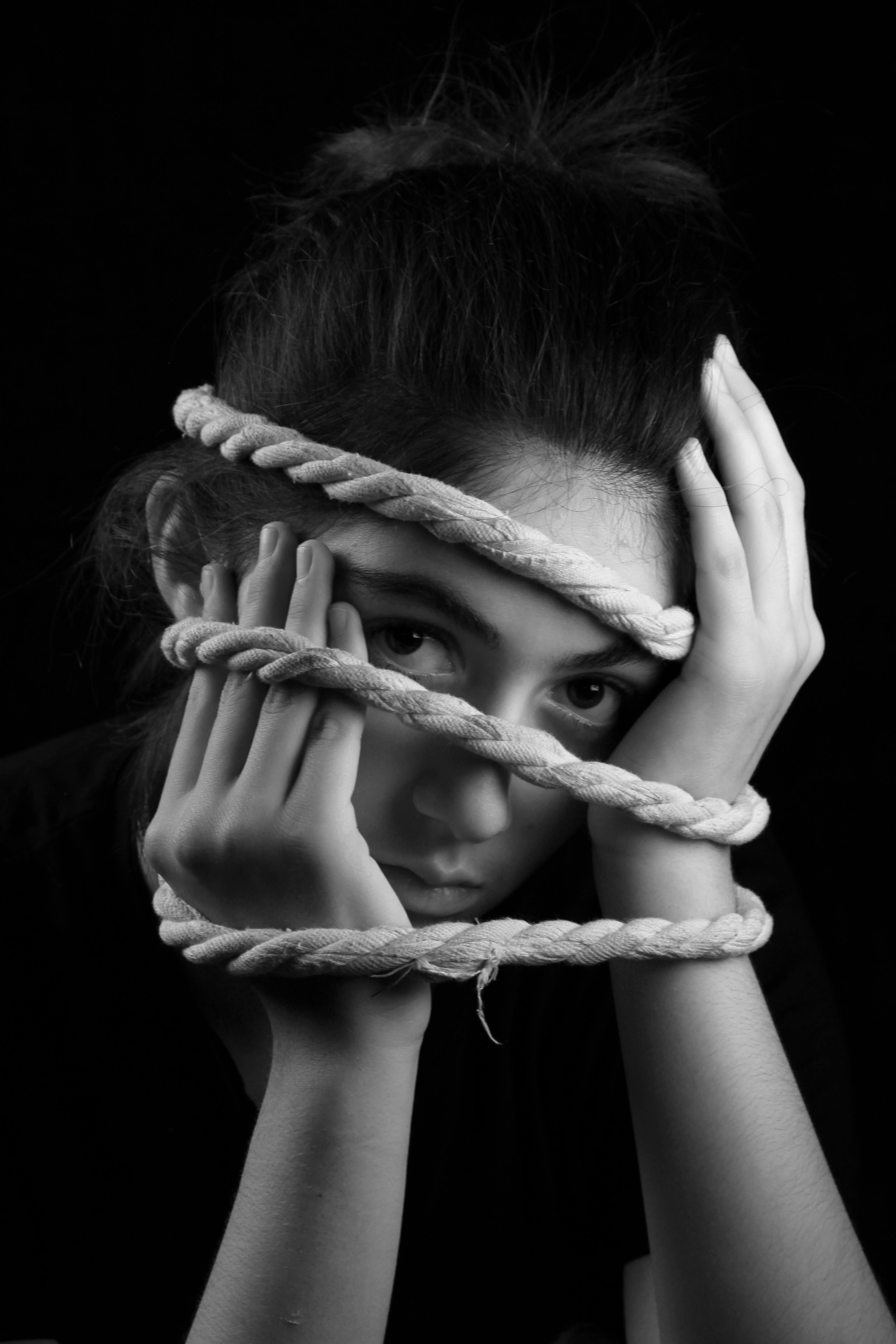 Grayscale Photo of a Woman Covering Her Face with Rope · Free Stock Photo
