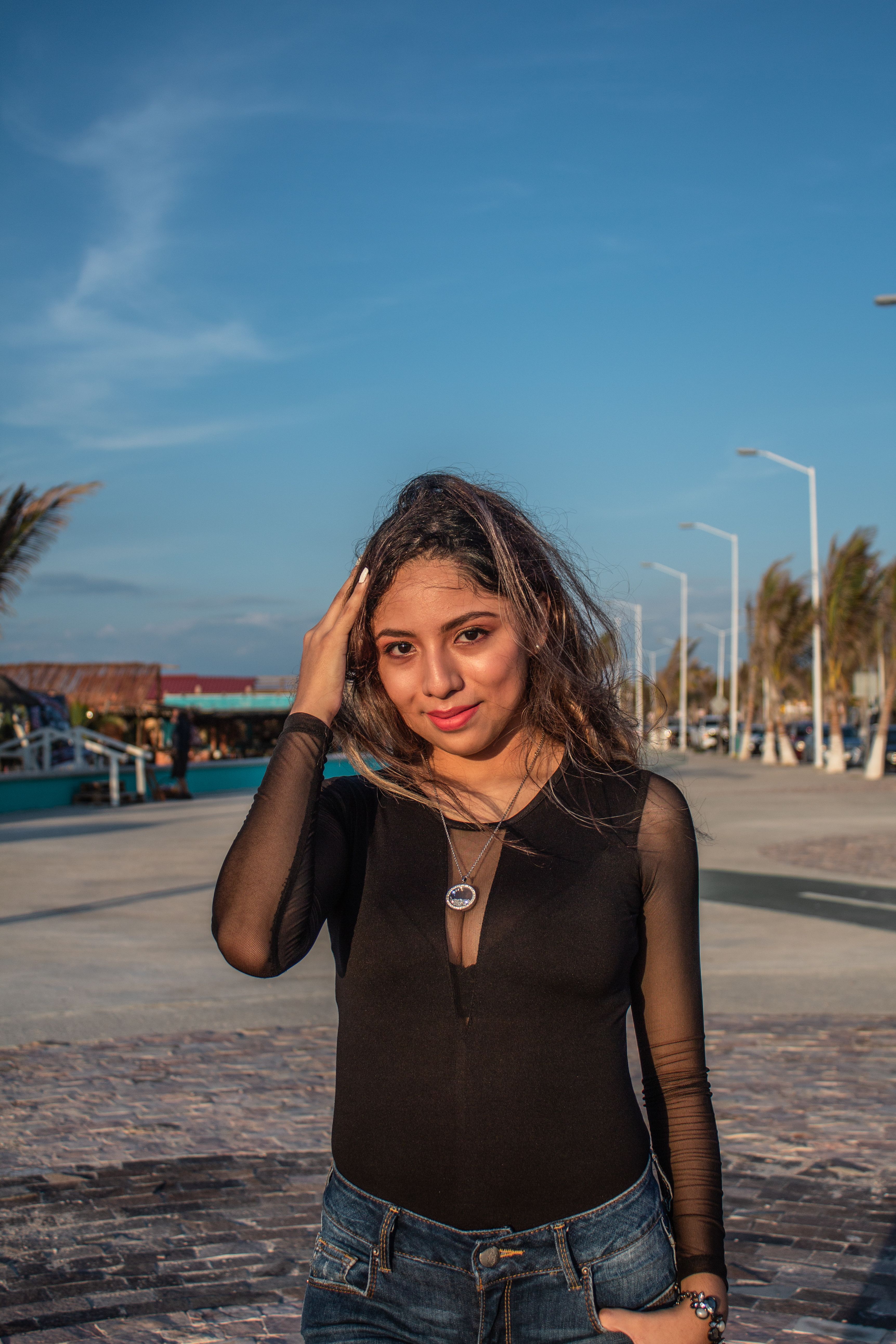 A Pretty Woman in Black Top Posing · Free Stock Photo
