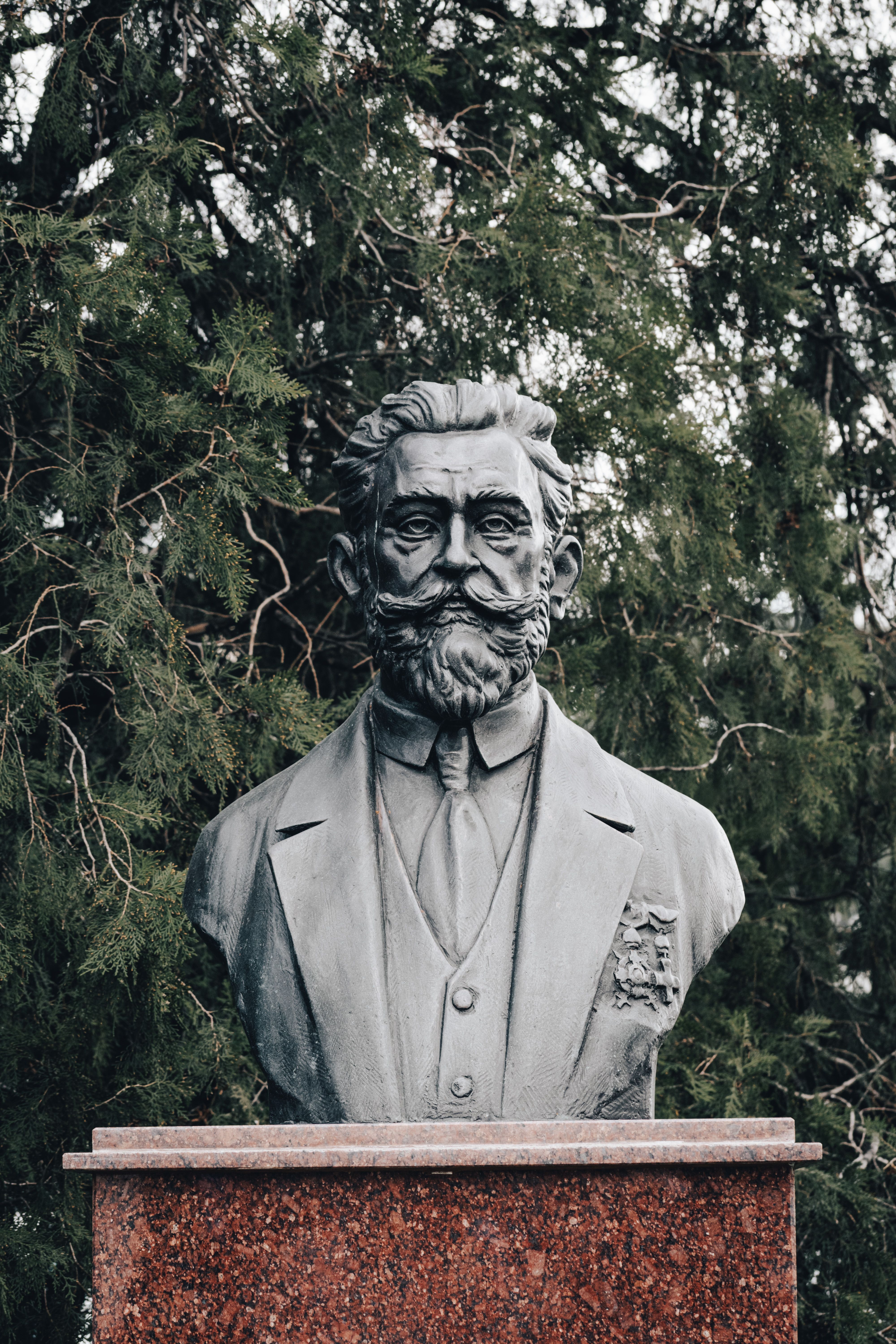 Gray Concrete Statue in Close Up Shot · Free Stock Photo