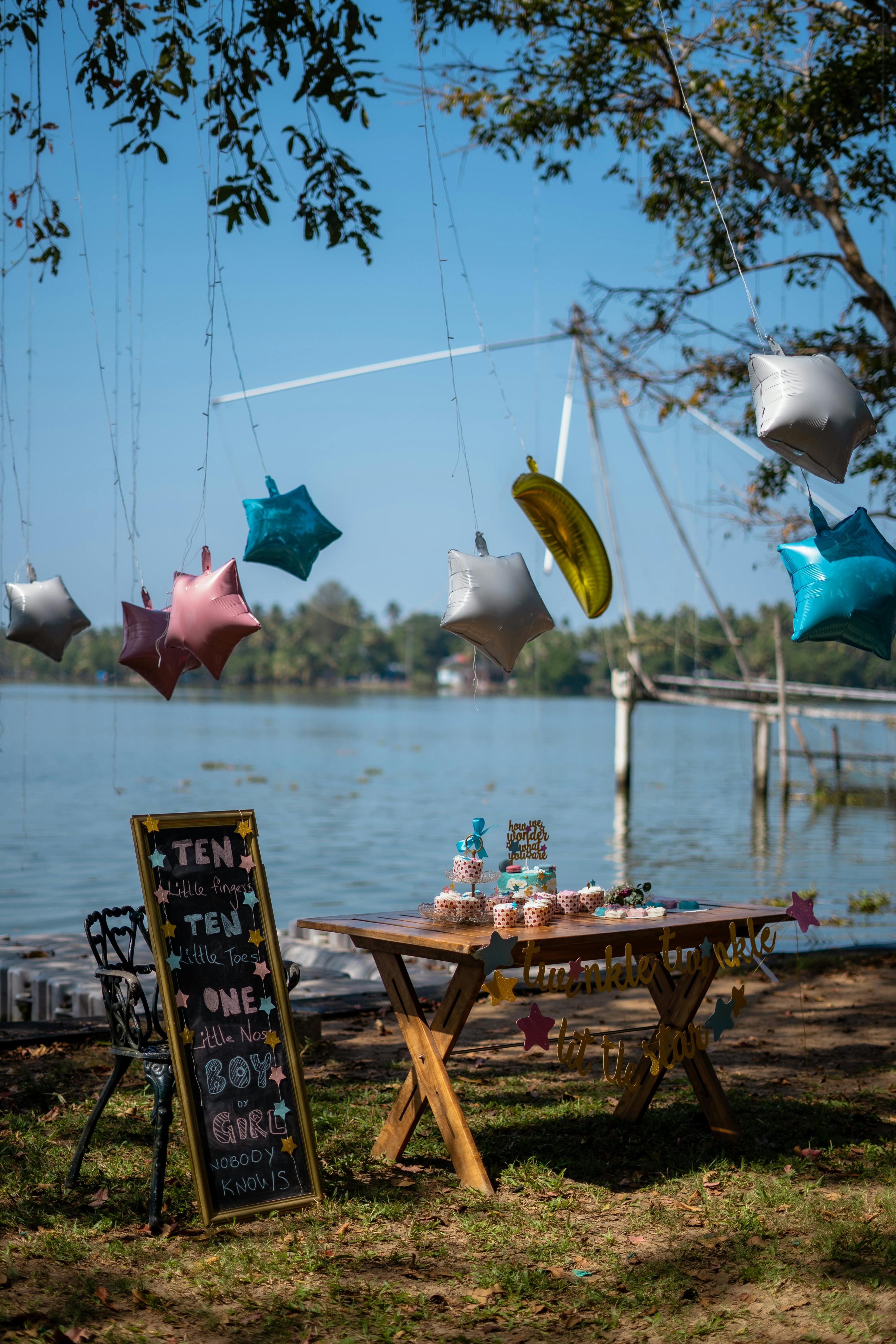 Party Decorations Near the Body of Water · Free Stock Photo