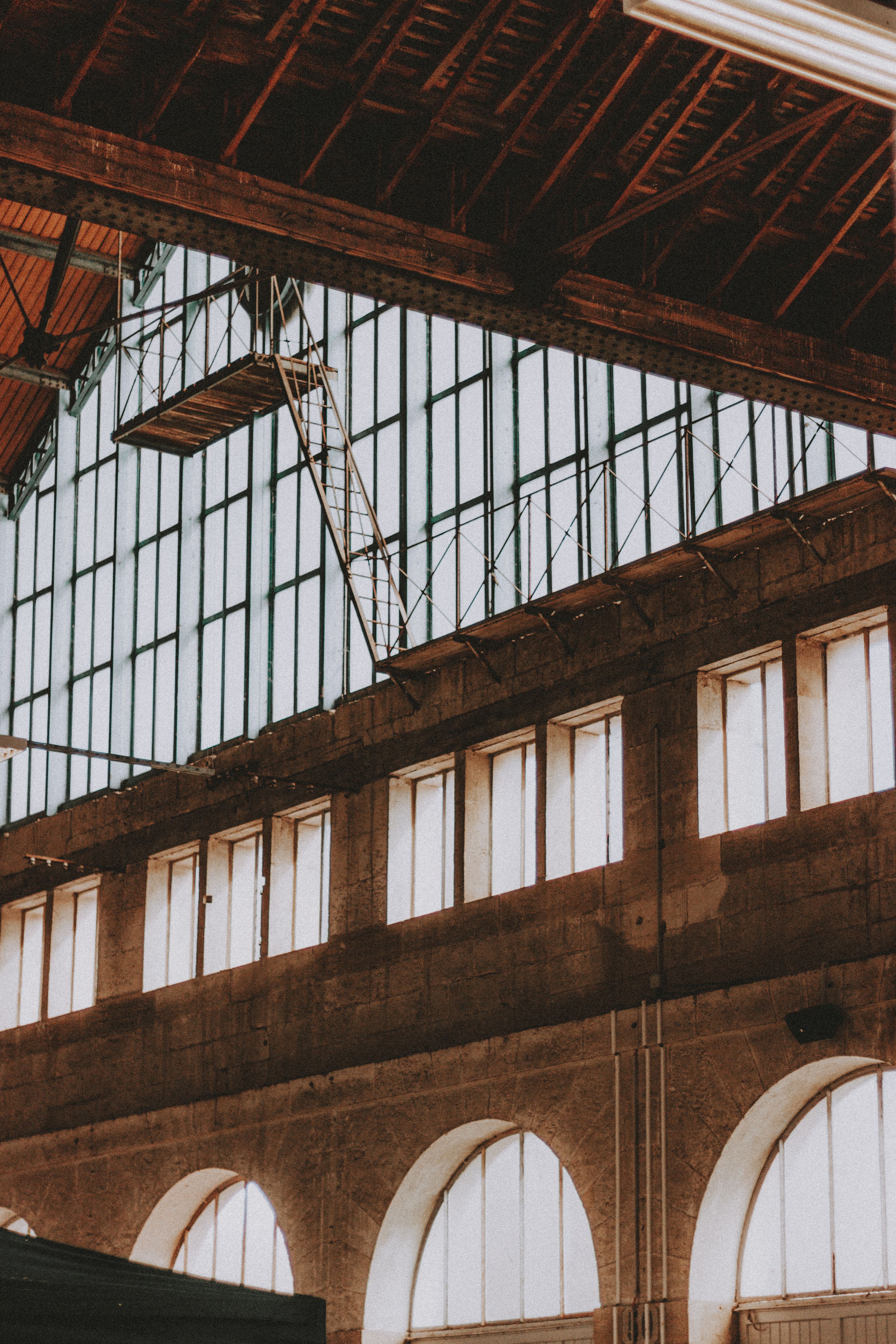 Building with stone walls and metal construction · Free Stock Photo