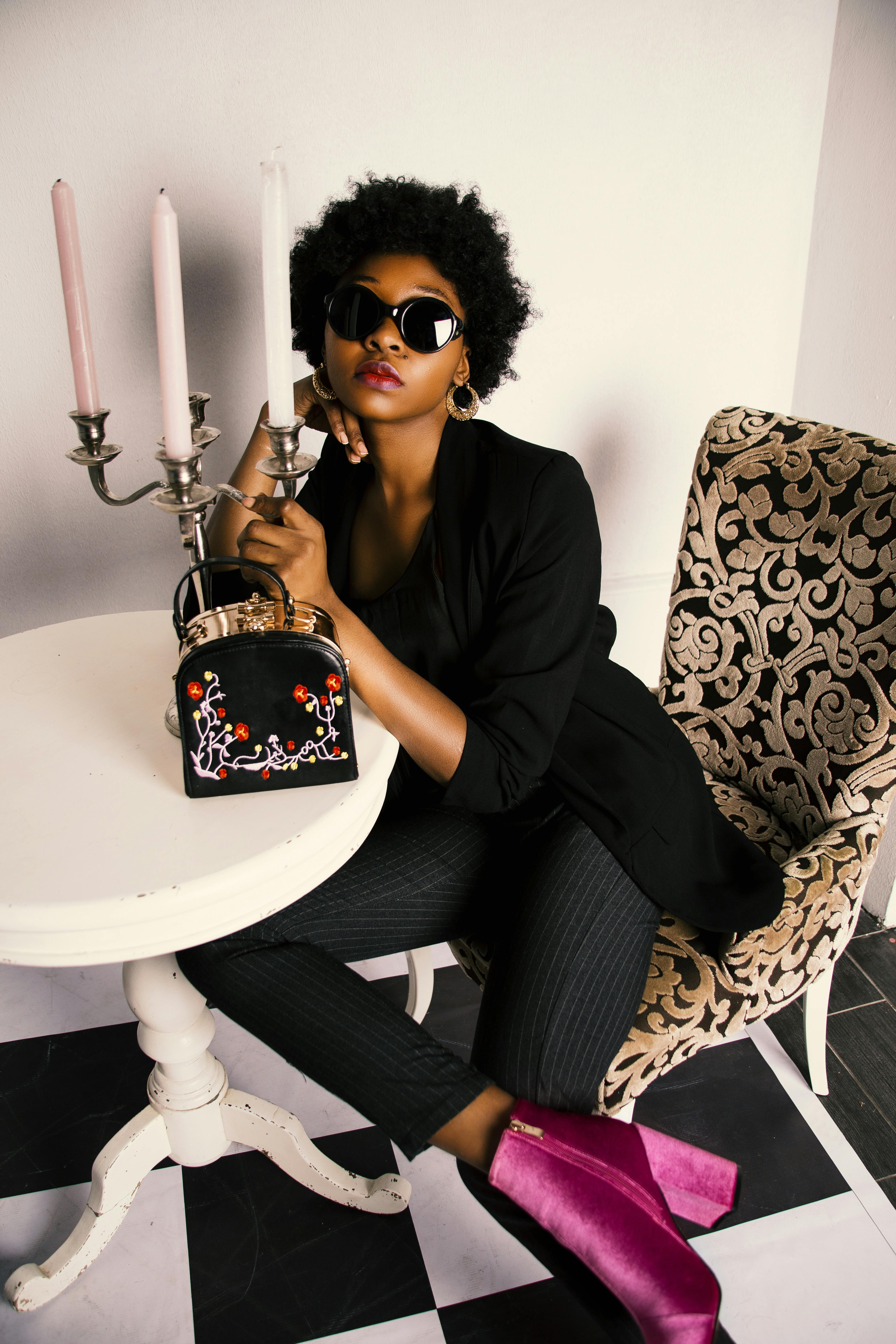 Woman Wearing White Tank Dress And White Frame Sunglasses Sitting And
