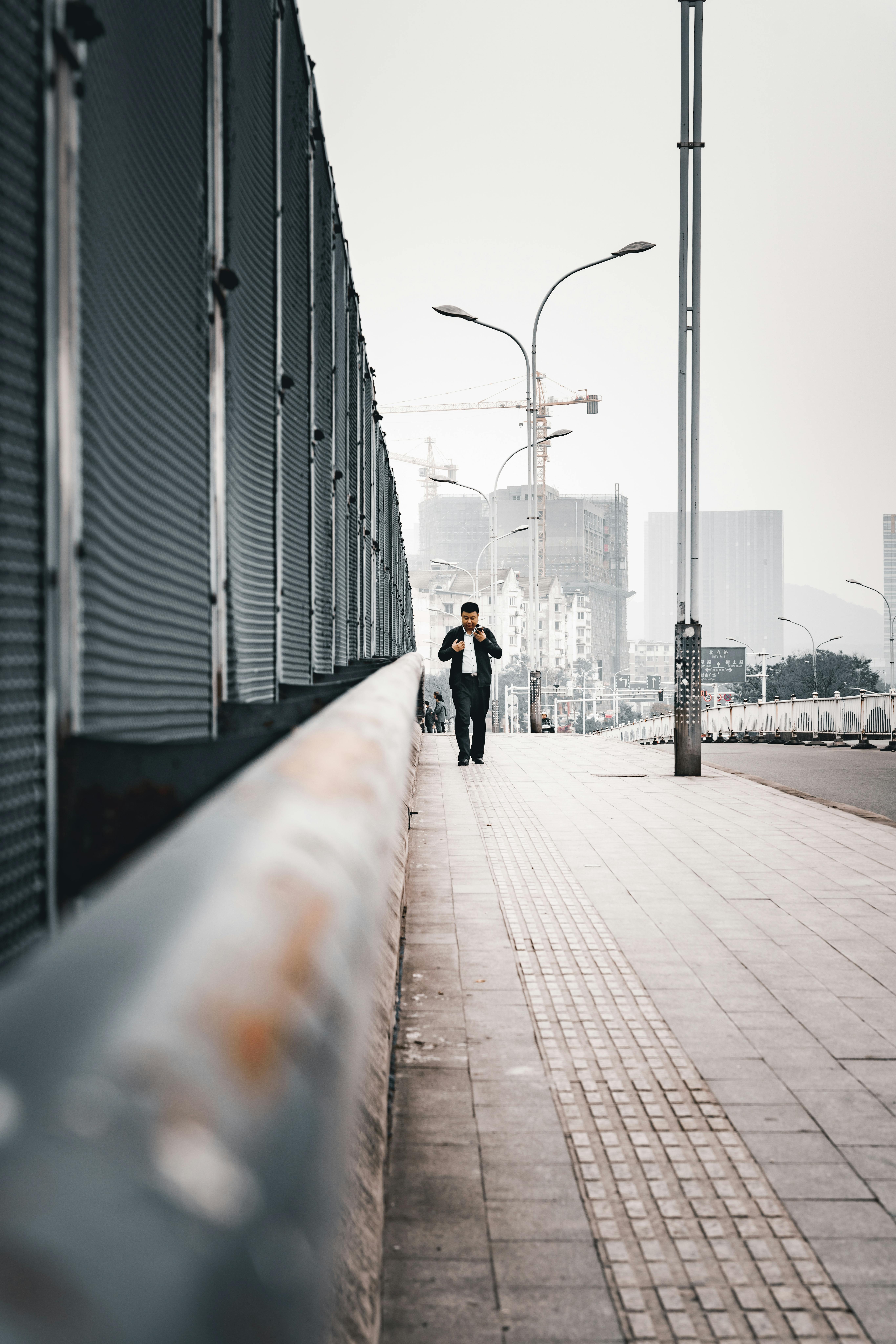 A Person Walking inside a Building · Free Stock Photo