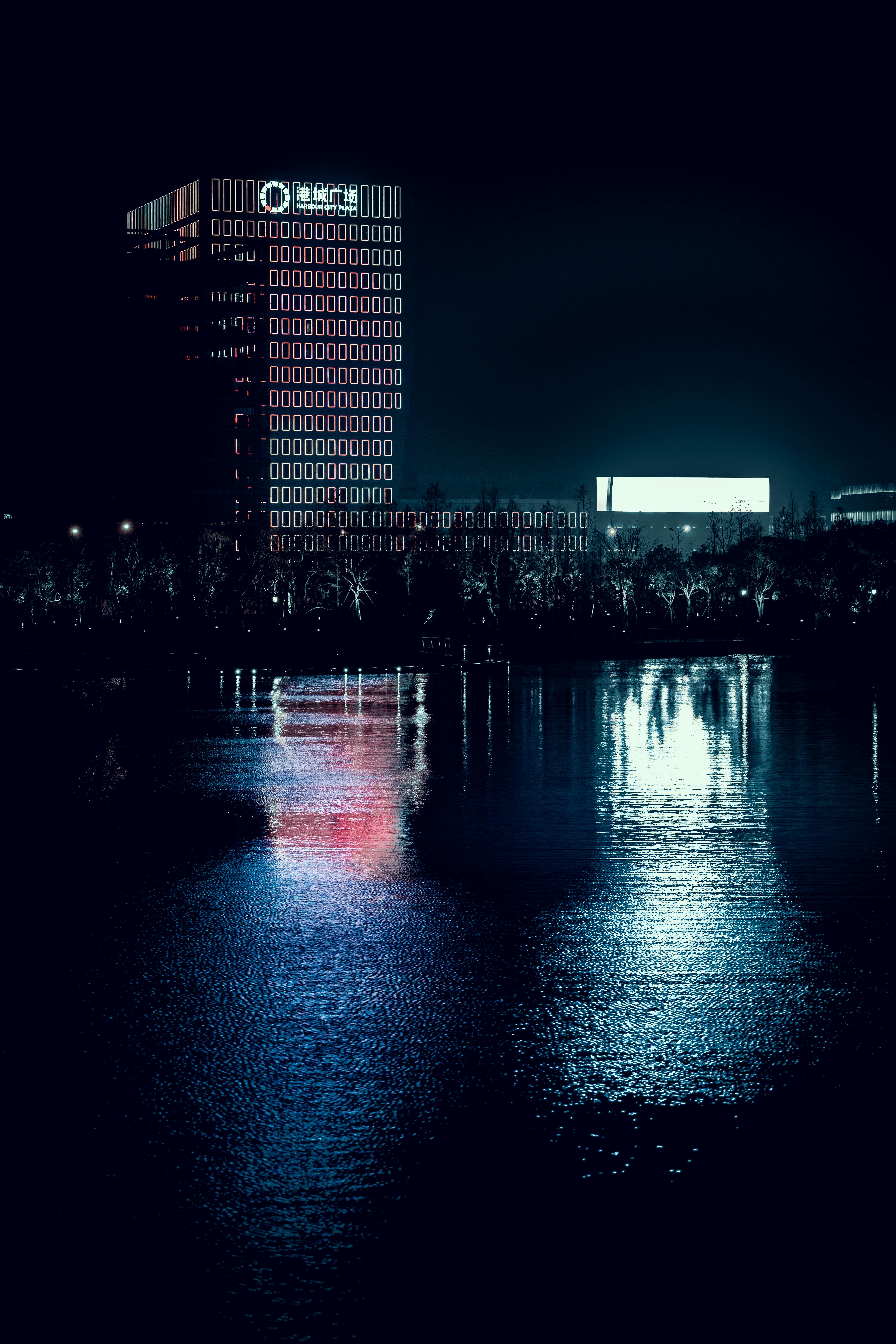 Body of Water with Reflections during Night Time · Free Stock Photo