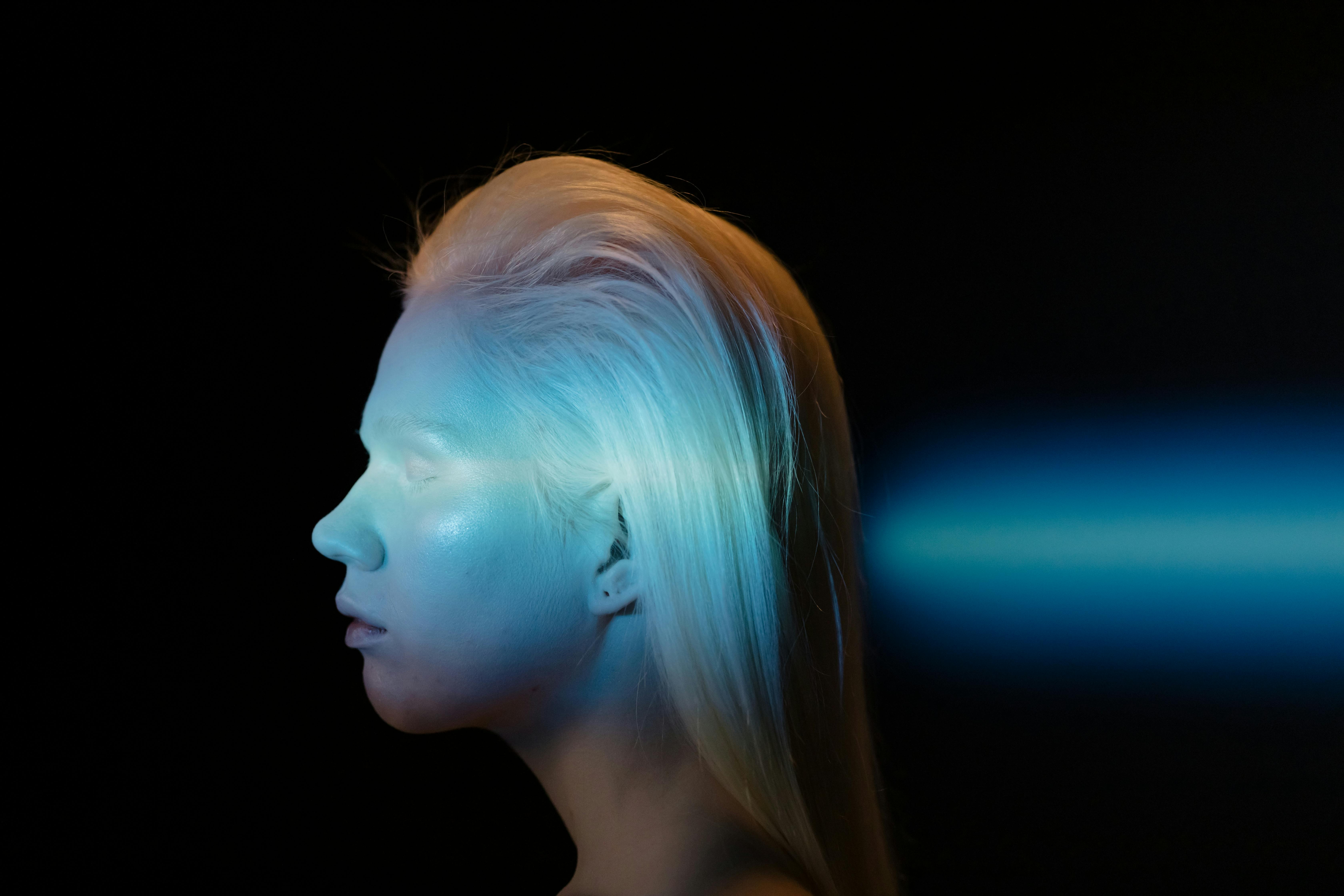 Close Up Photo of Woman with Blue Light on Her Face · Free Stock Photo