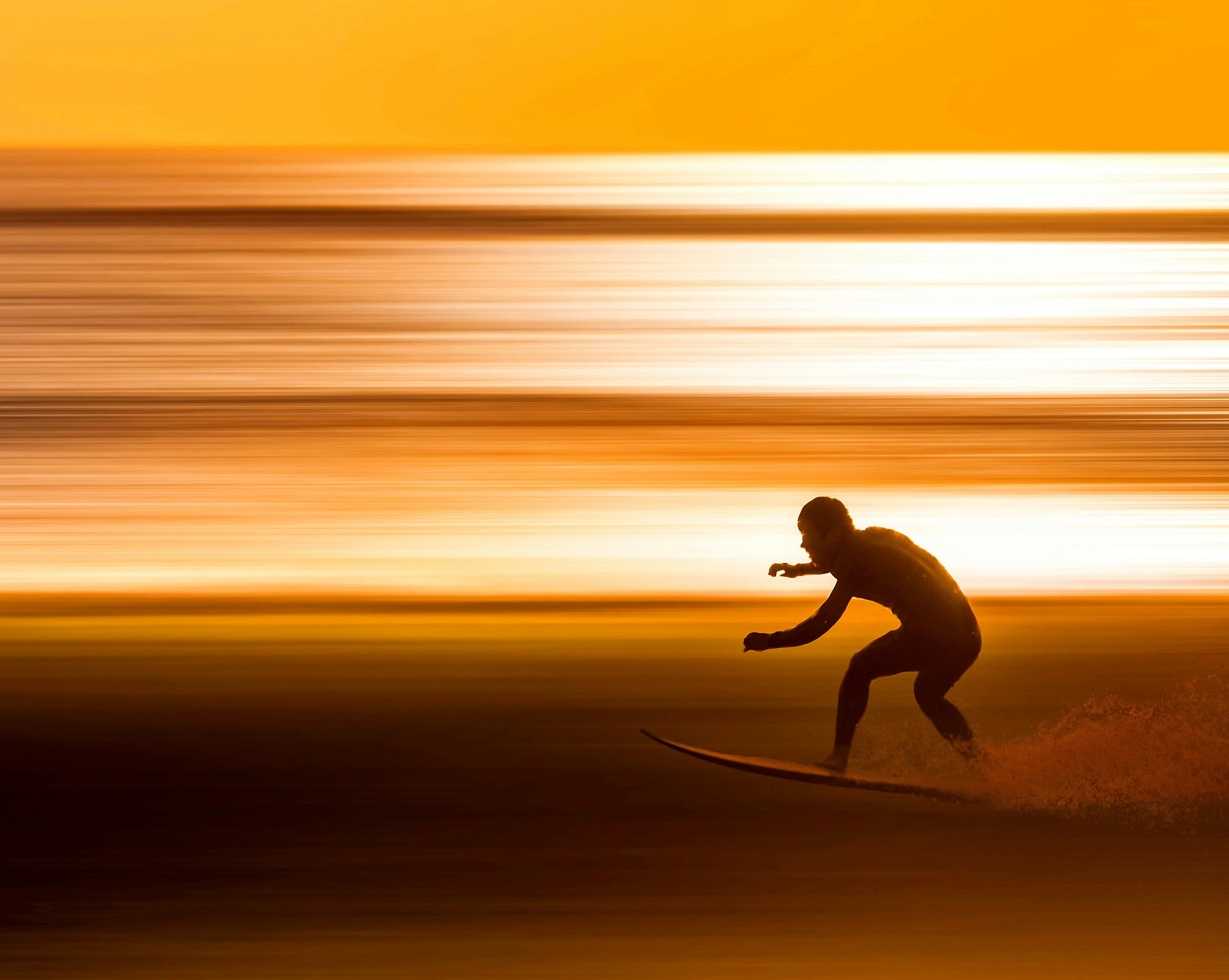 A Man Surfing During Sunset · Free Stock Photo