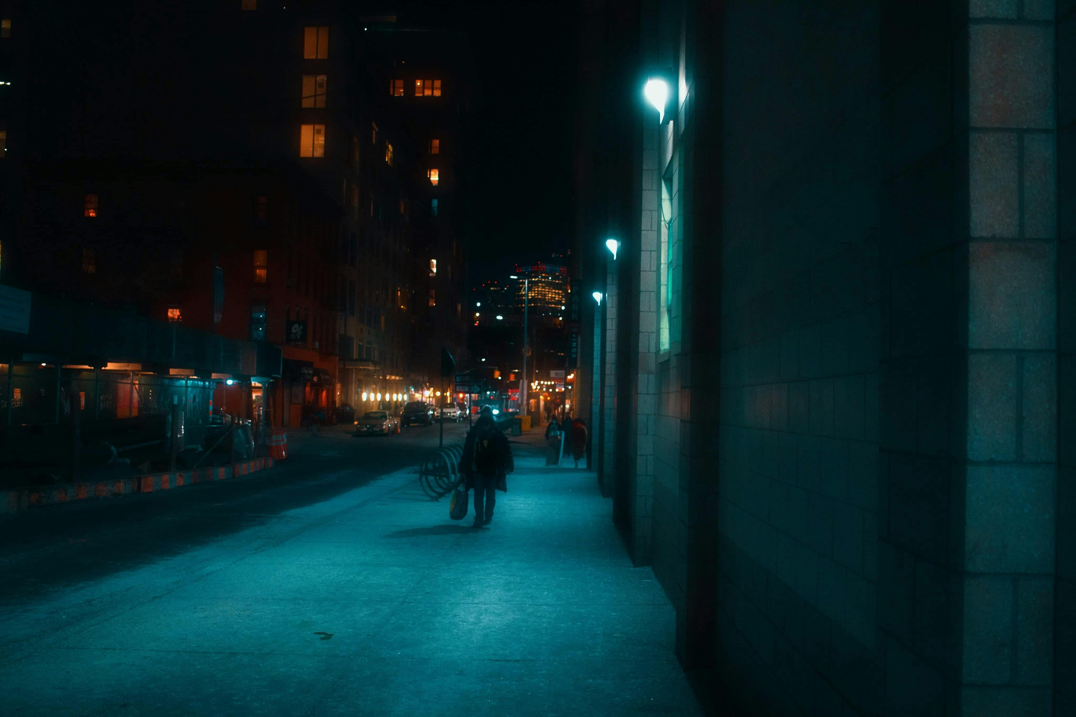 Person walking on street in night time · Free Stock Photo