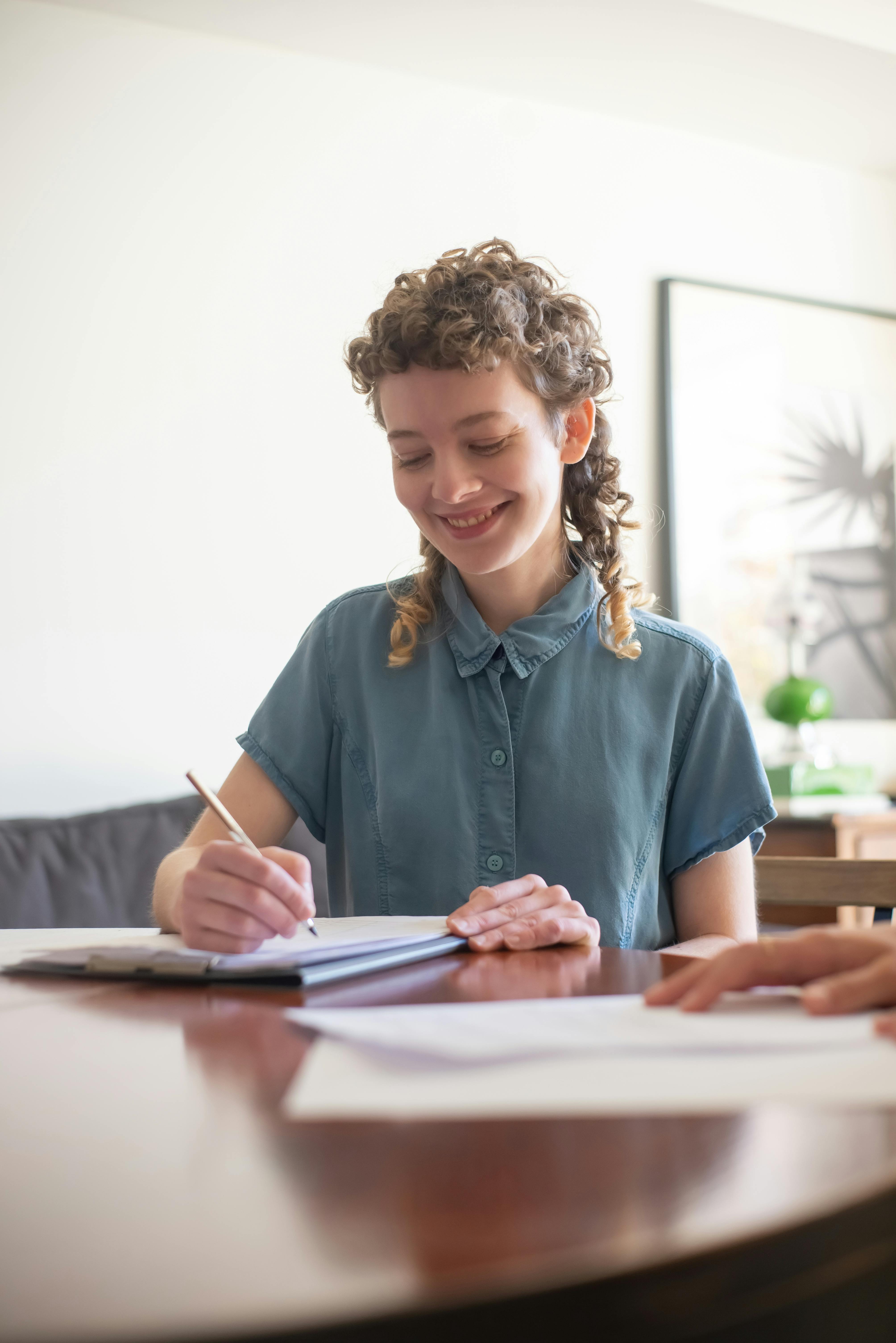 A Woman Writing a List · Free Stock Photo