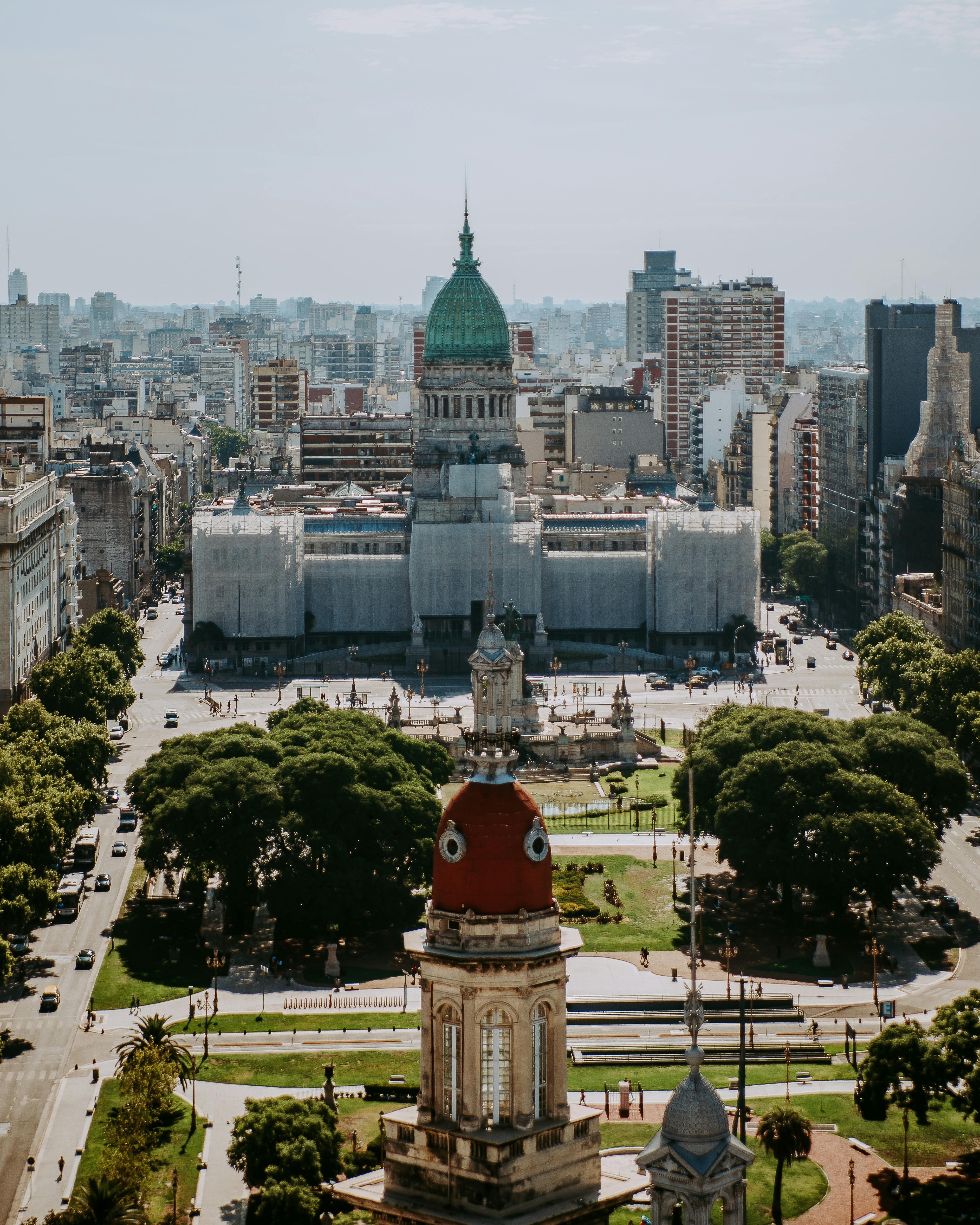 Park near Buildings in City · Free Stock Photo