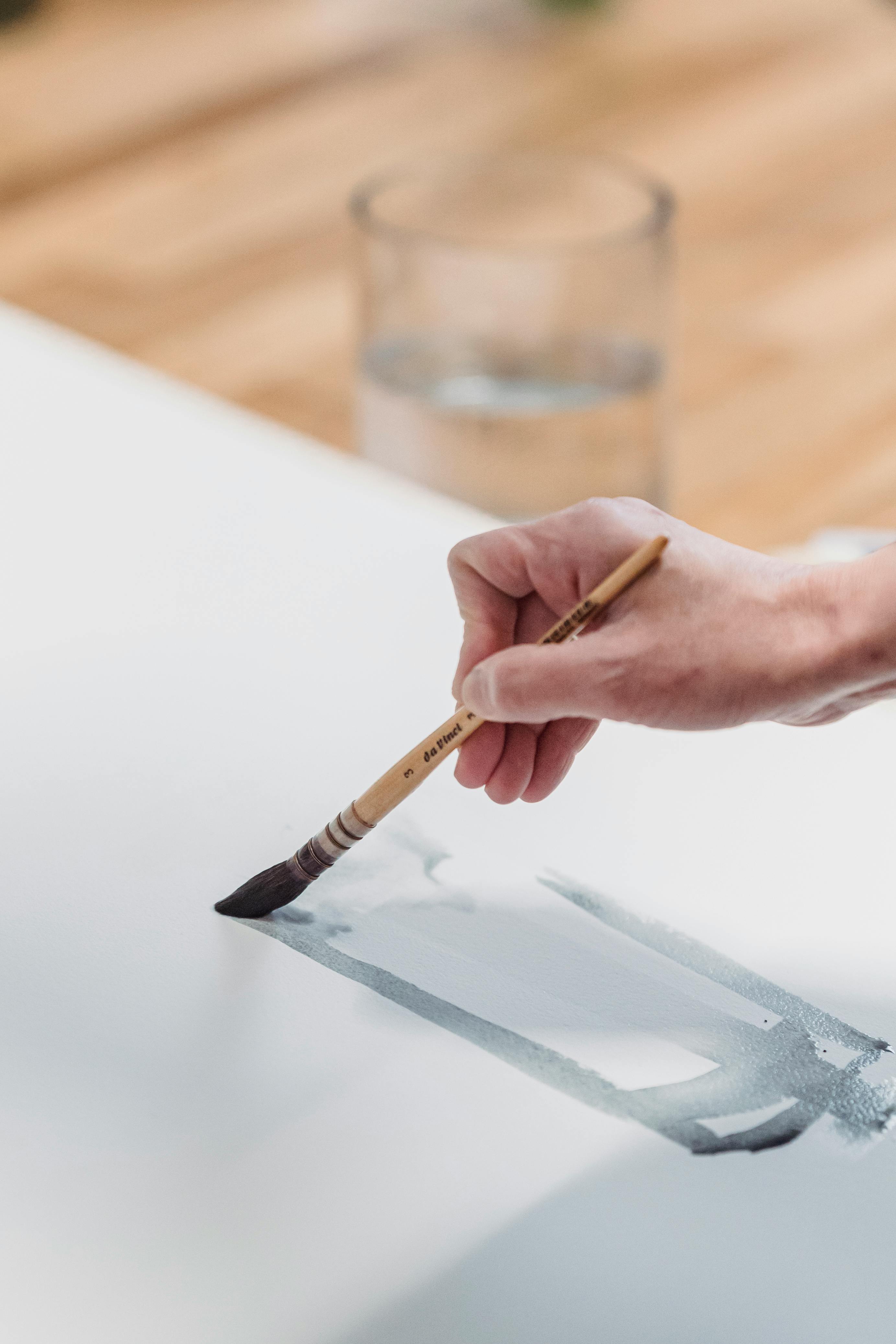 Person Painting an Artwork · Free Stock Photo