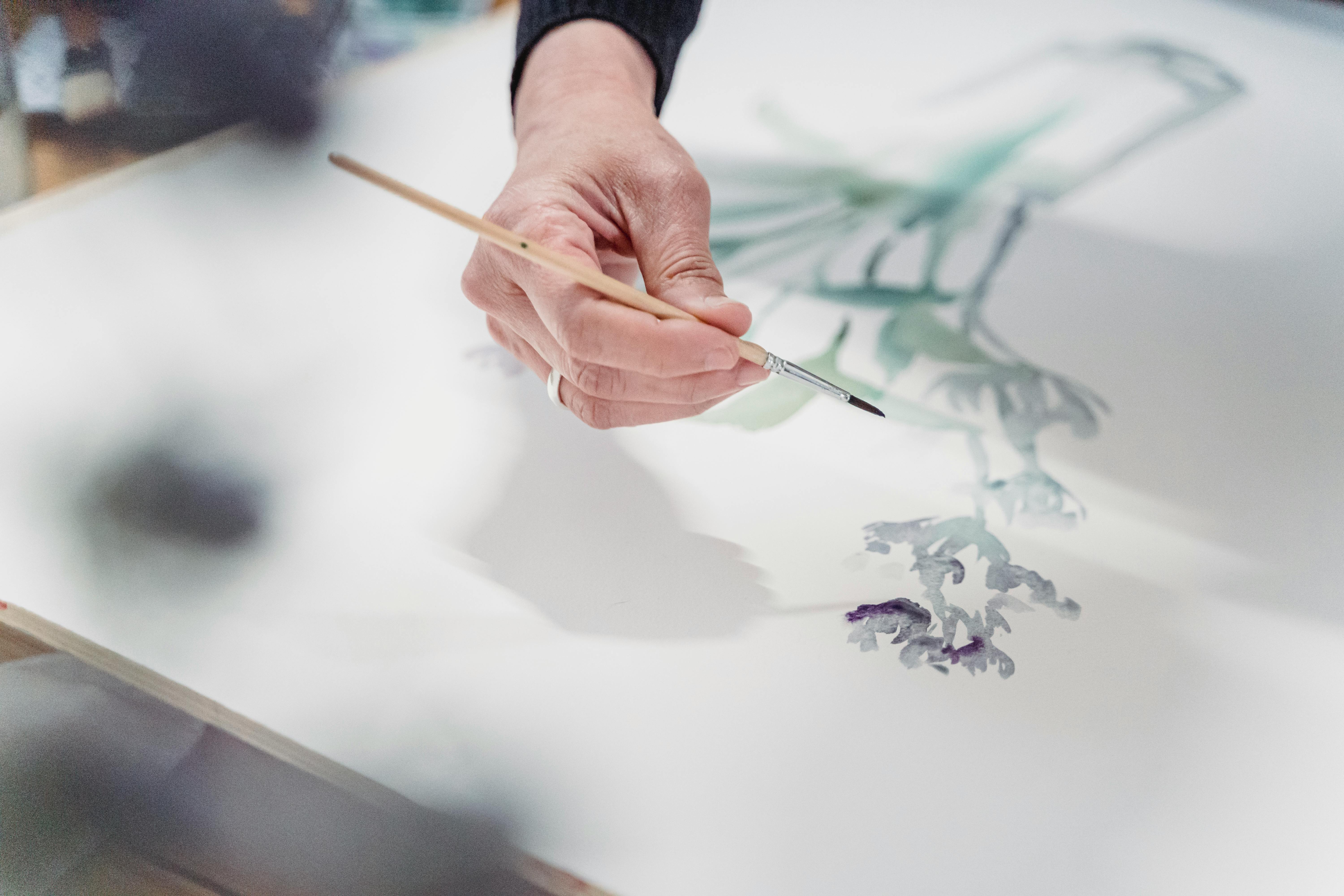 Person Painting an Artwork · Free Stock Photo