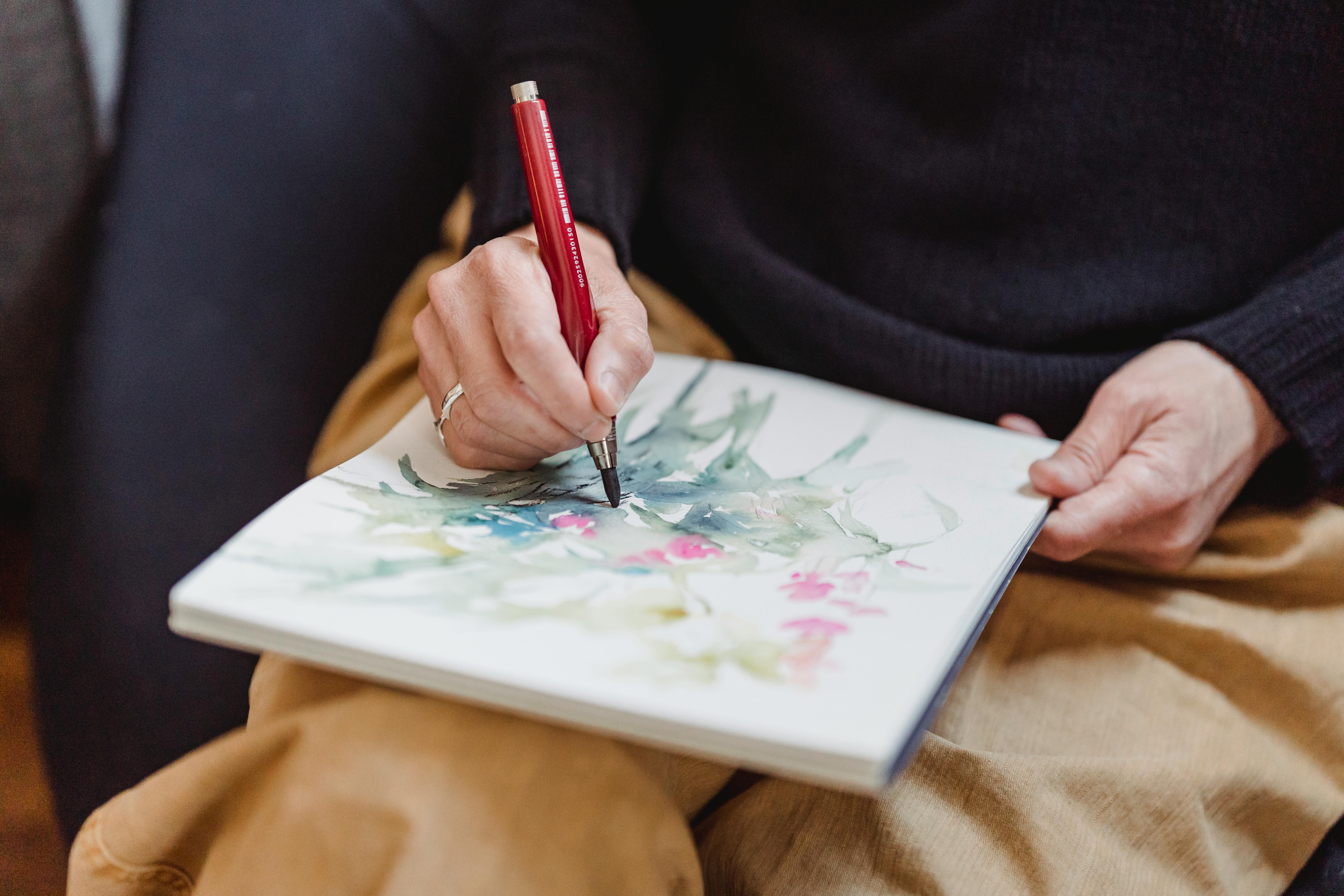 Person Drawing an Artwork · Free Stock Photo