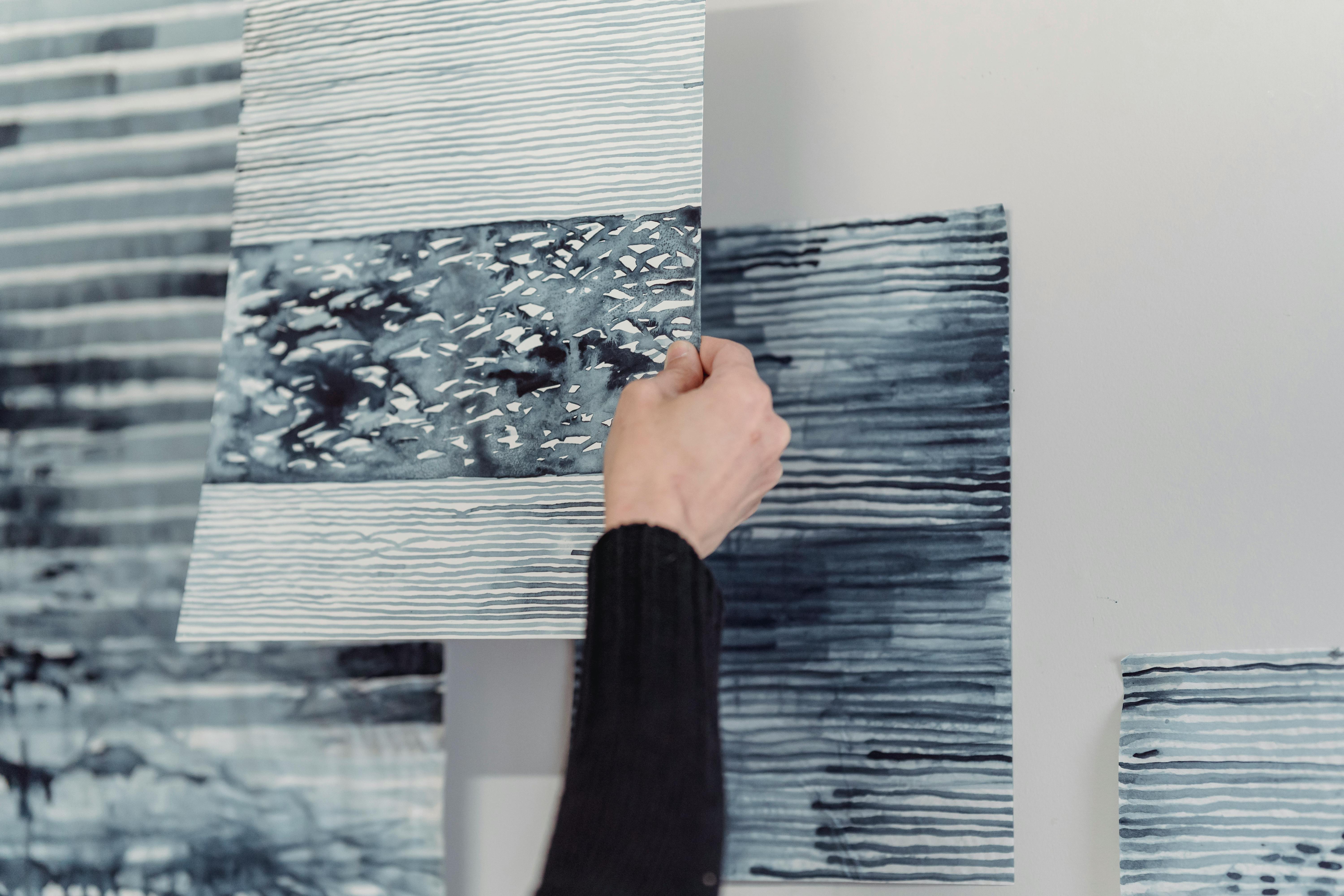 Person Holding an Abstract Painting · Free Stock Photo